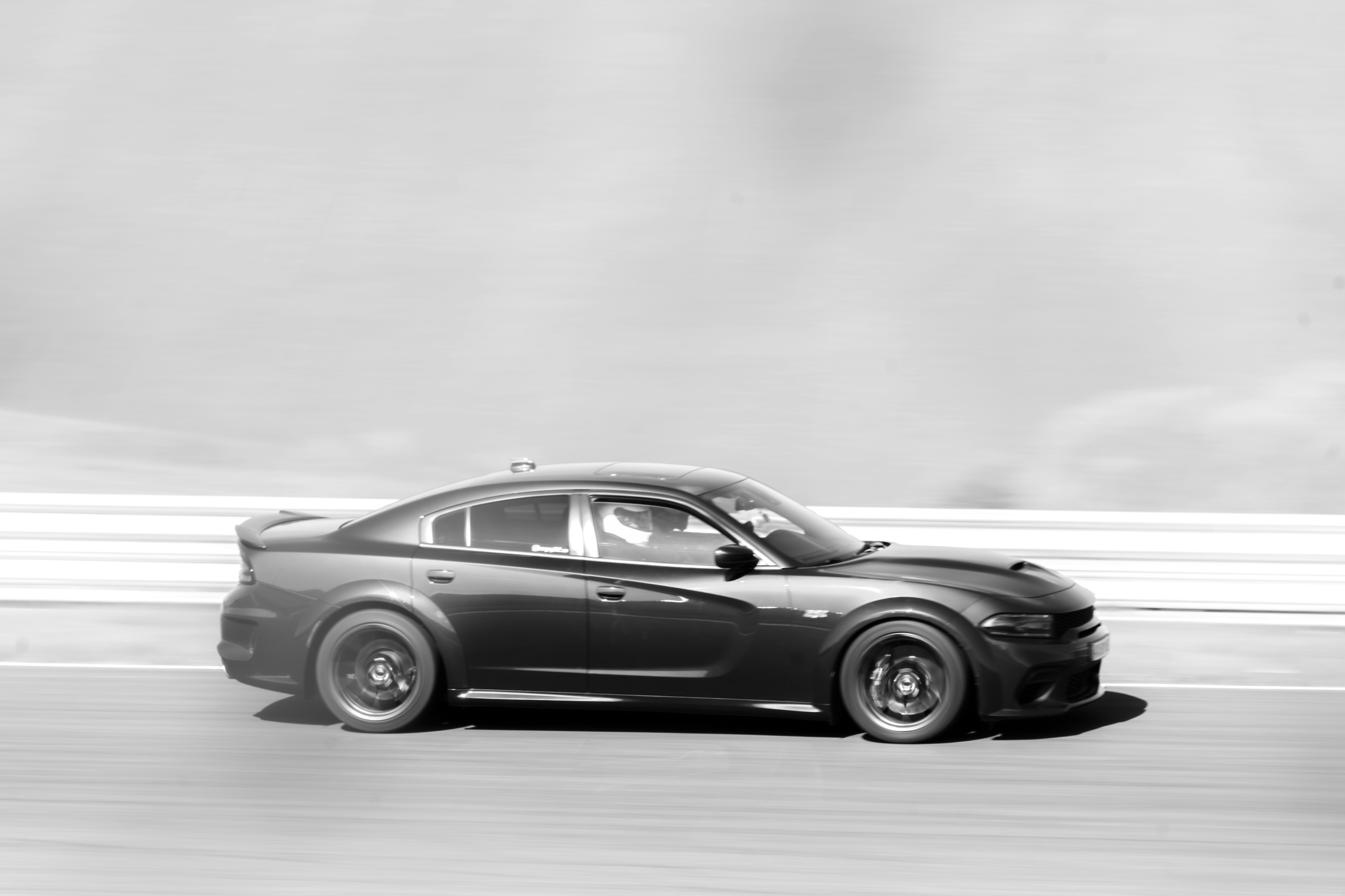 Low-Slung Chrome: A Sleek Black Streak on the Track