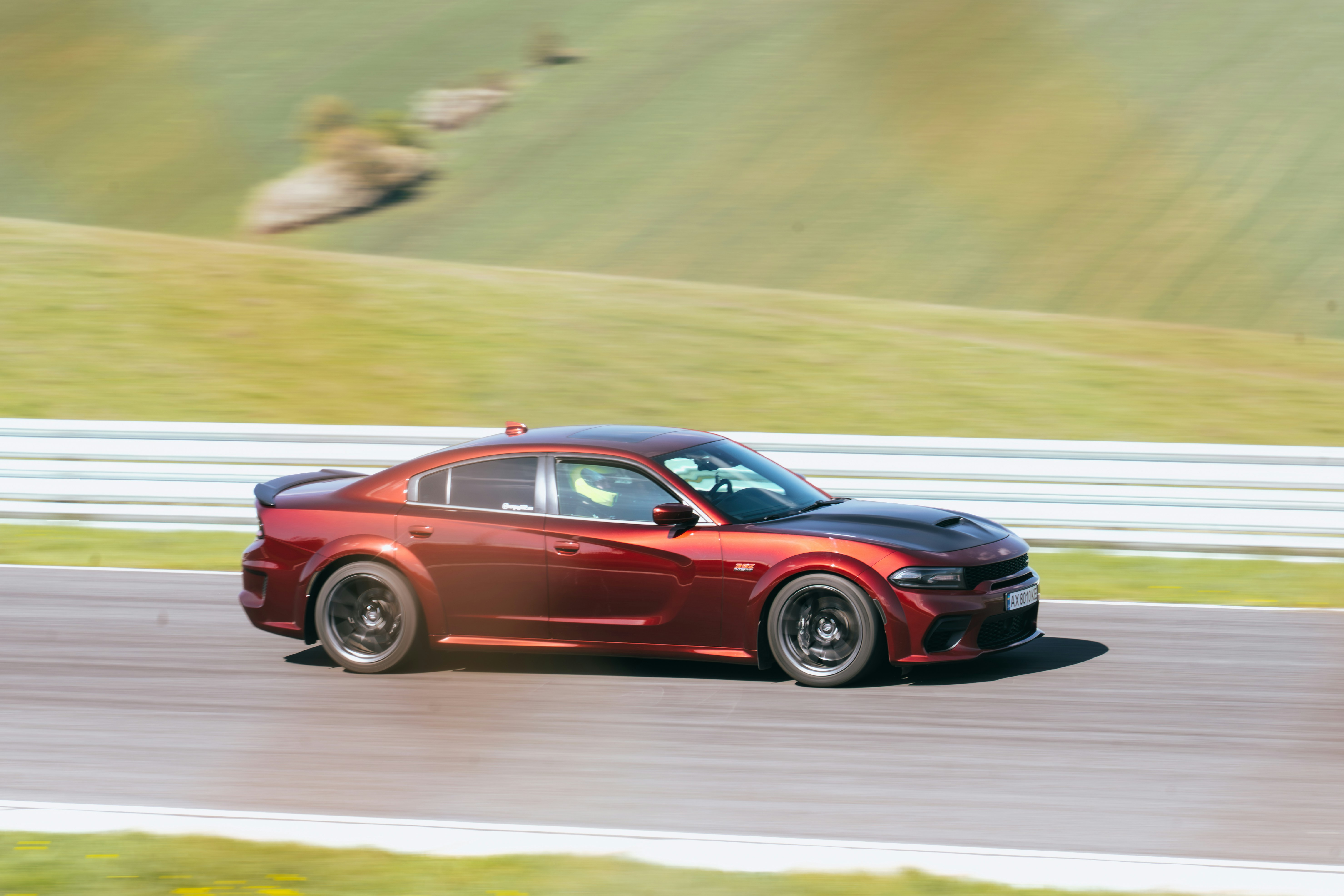Red Racing: A Shutter-Blurred Burst Down the Curved Track