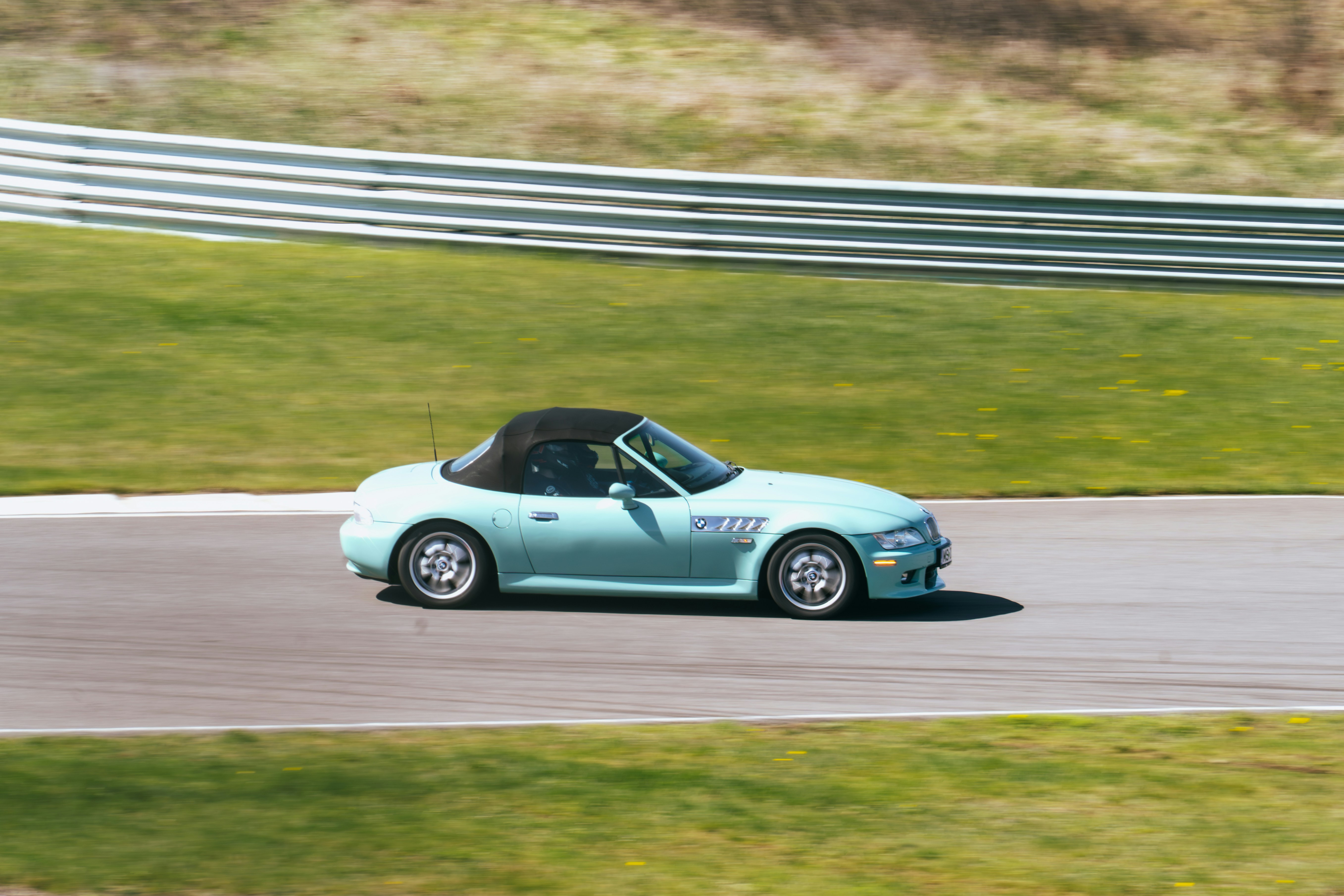 Minted Convertible in Motion on a Race Strip