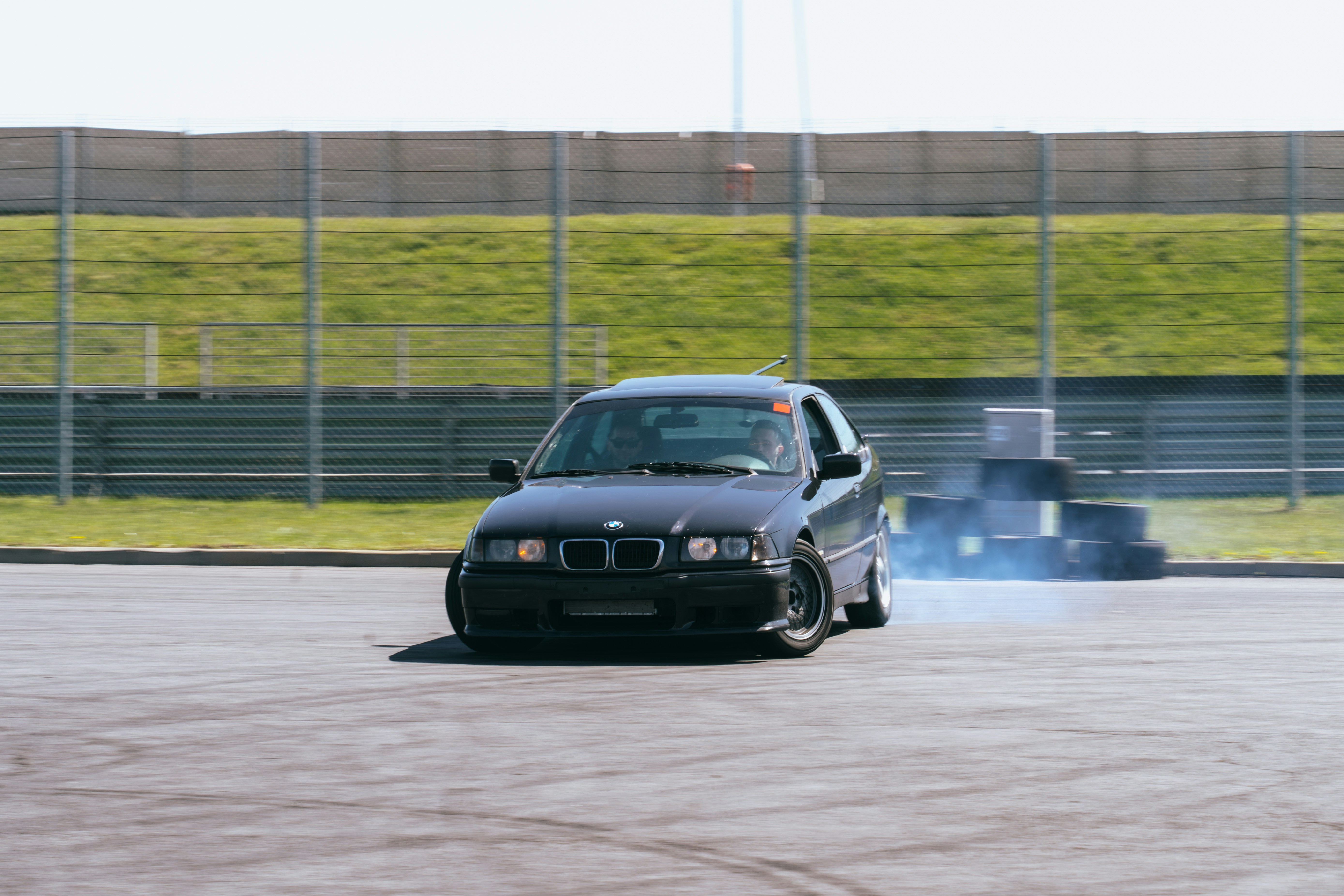Drift in Slow Burn: A Black BMW Slides Through the Track