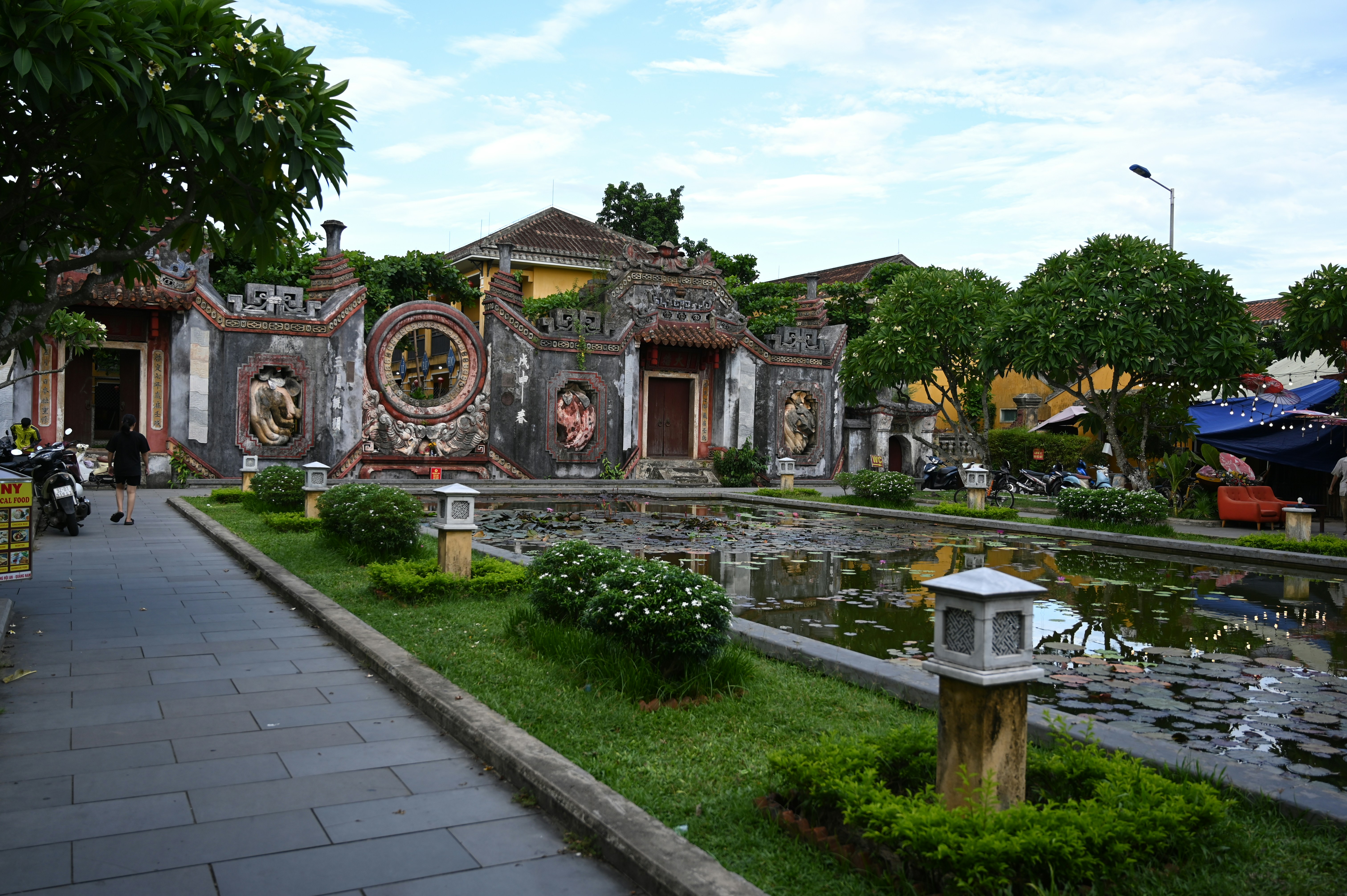 Ornate courtyard water feature framed by carved gateways