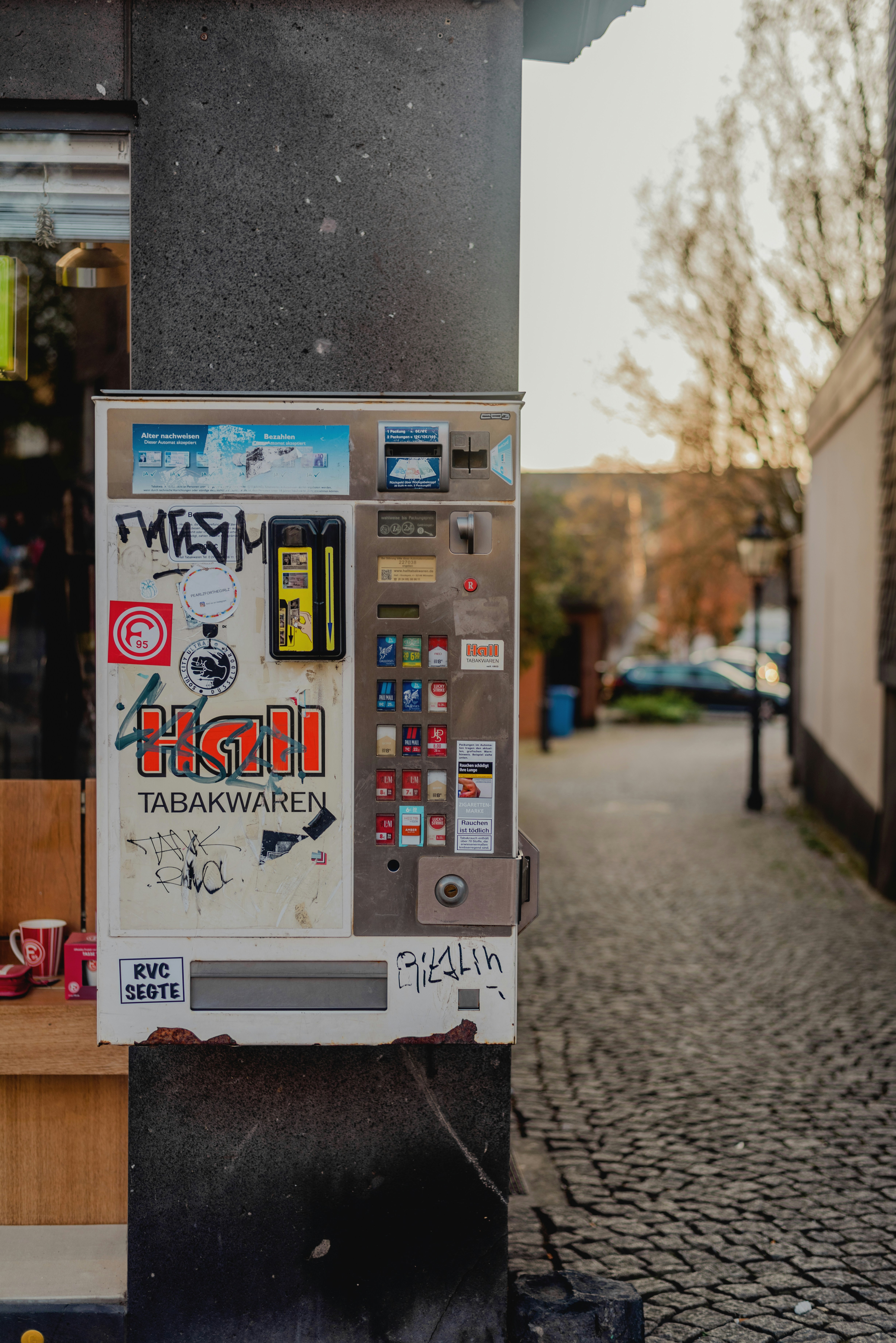 Street Vending Machine Echoes with Graffiti and Cobblestones