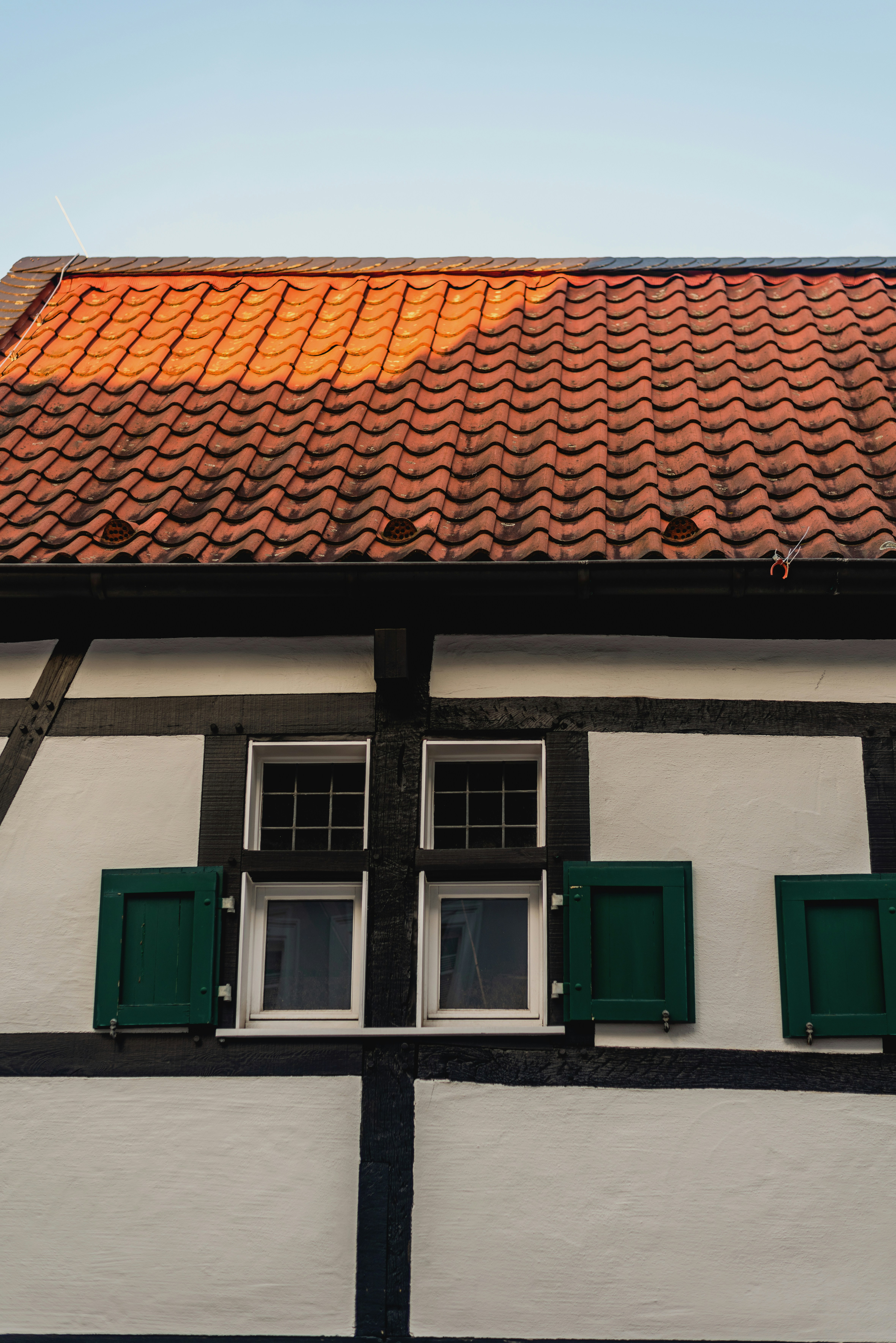 Sunlit Tiles over a Dutch-Style Facade