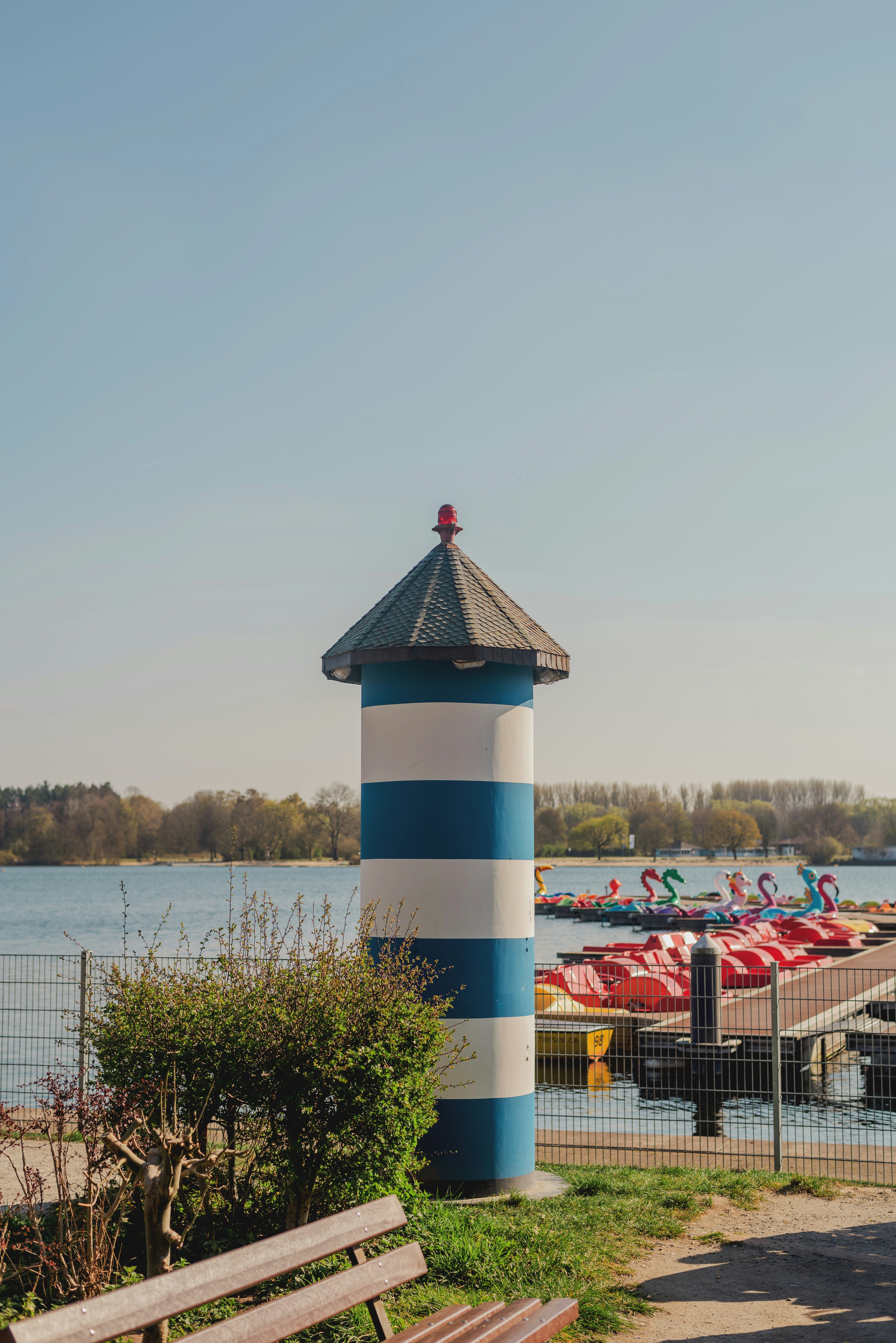 Blue-Striped Lighthouse by the Shoreline Ride