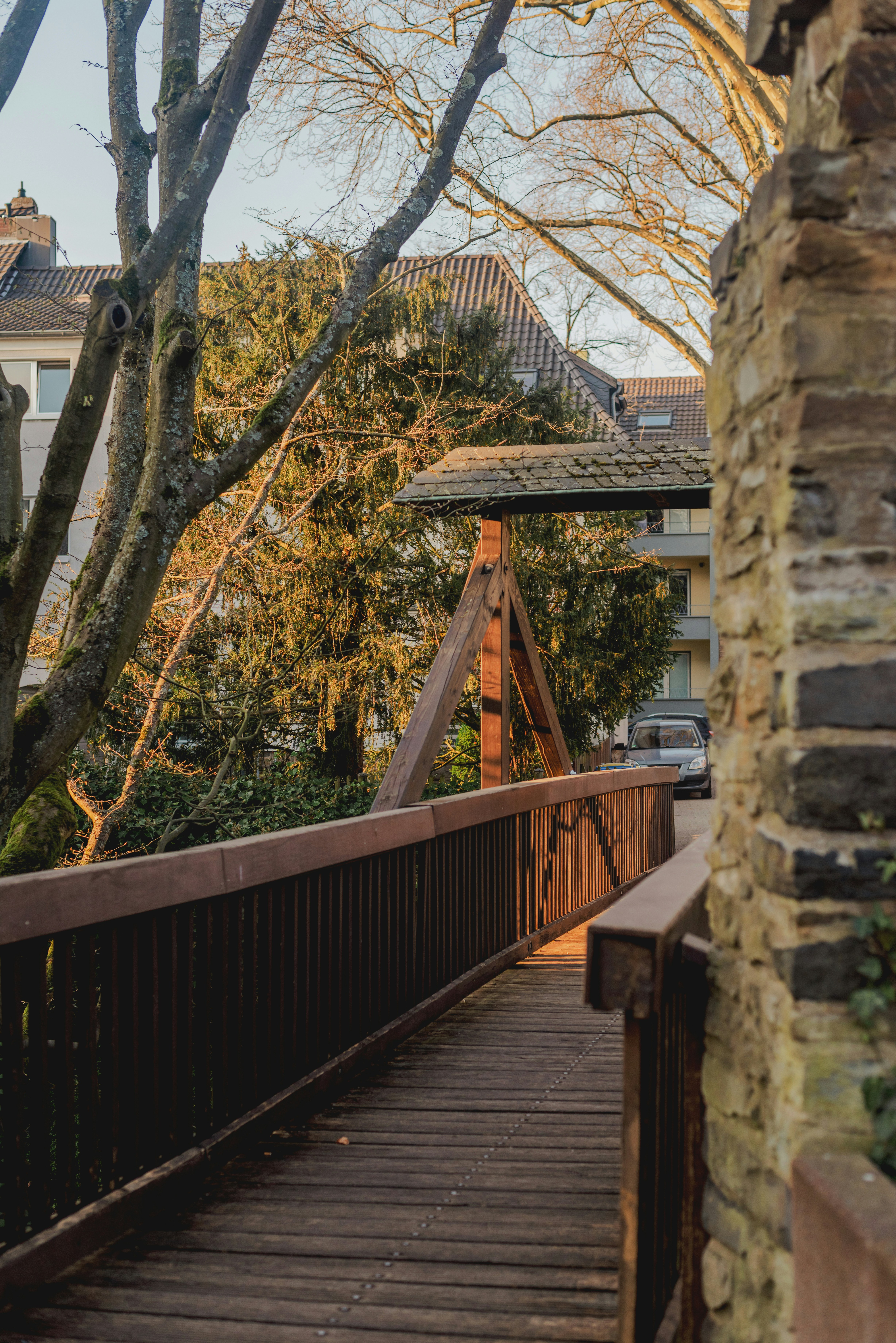 Bridge Walkway Through a Quiet Courtyard at Dusk