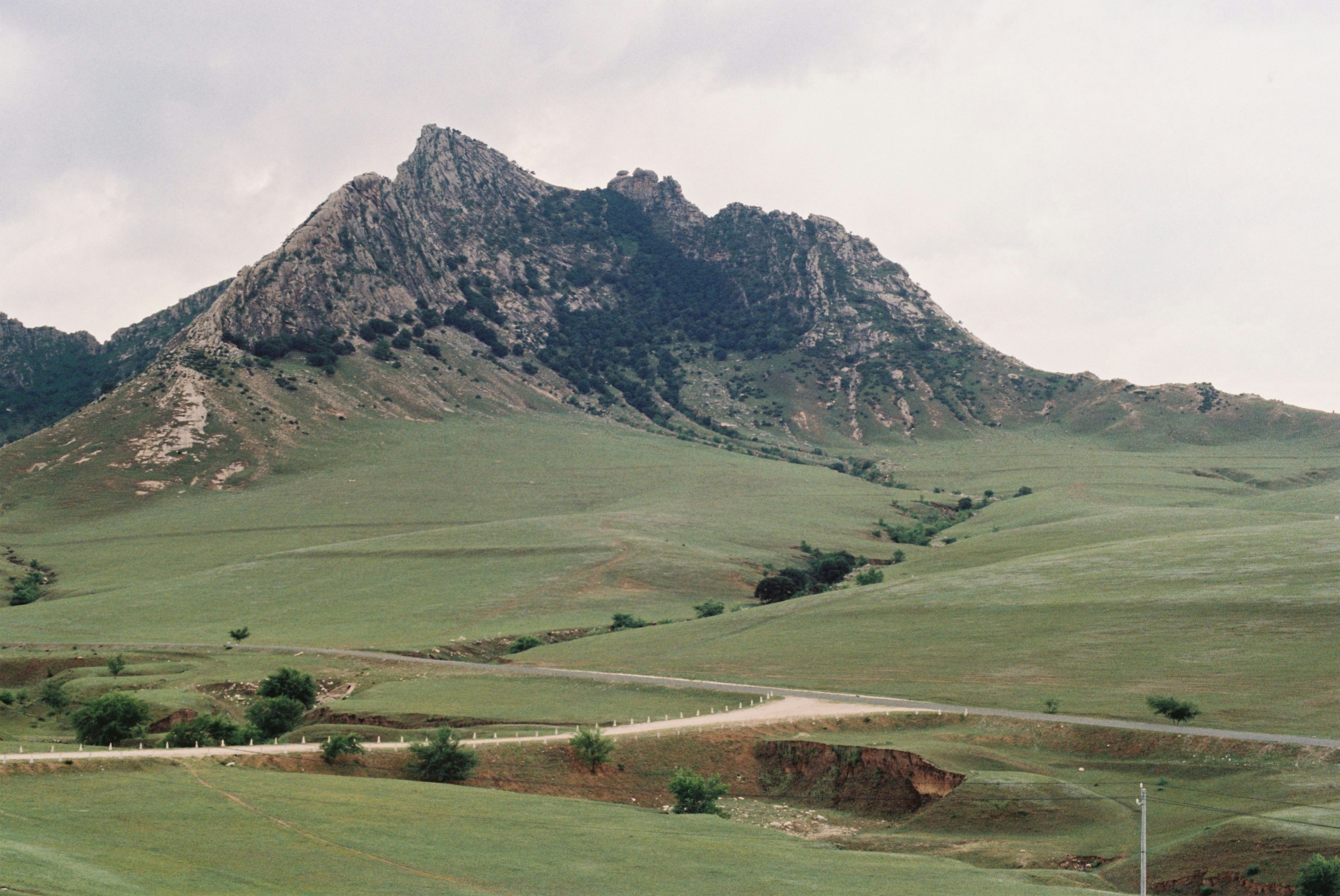 Ridge and Rolling Hills Under a Quiet Sky
