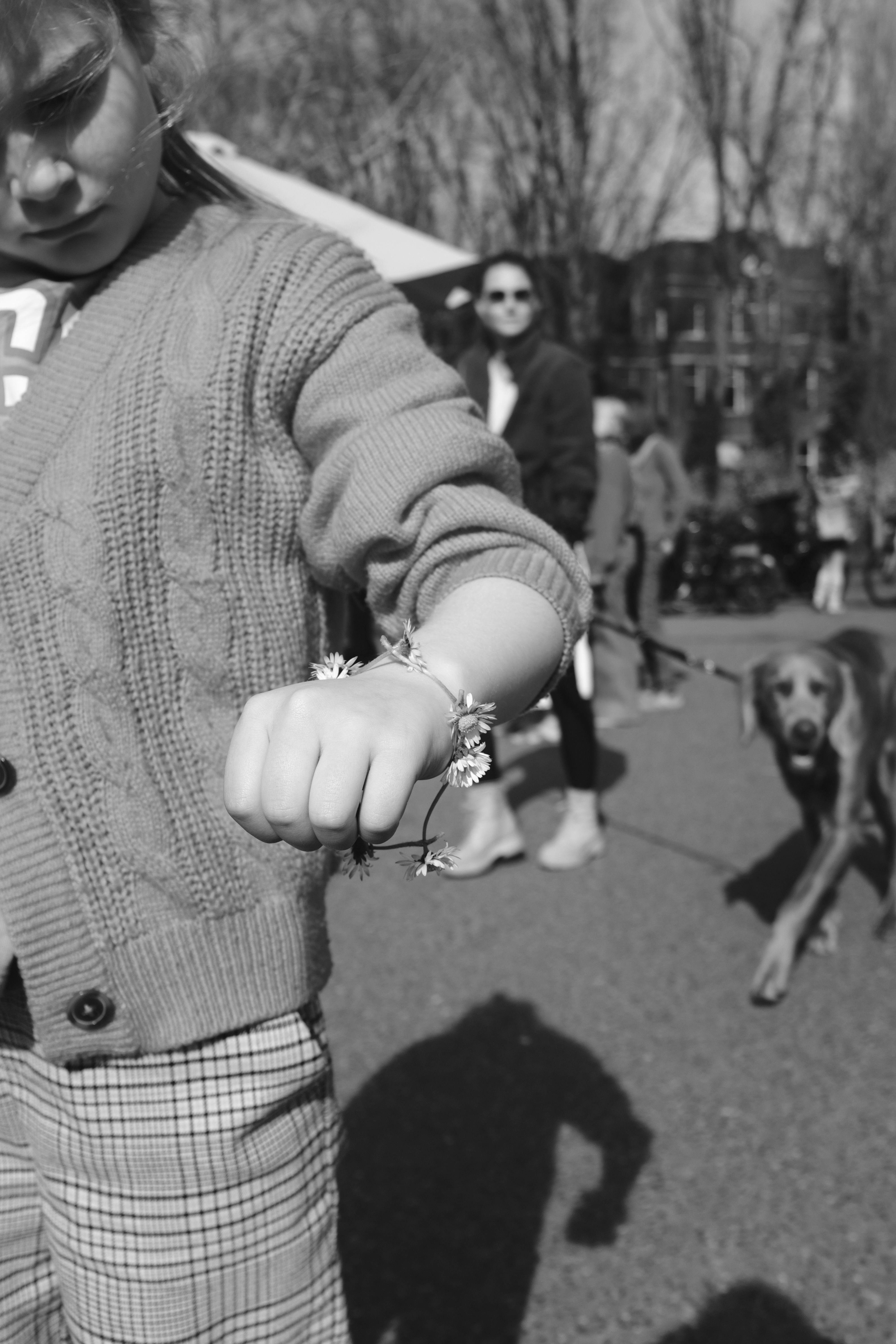Daisy Chain in Focus: A Forward Pose at a Street Festival