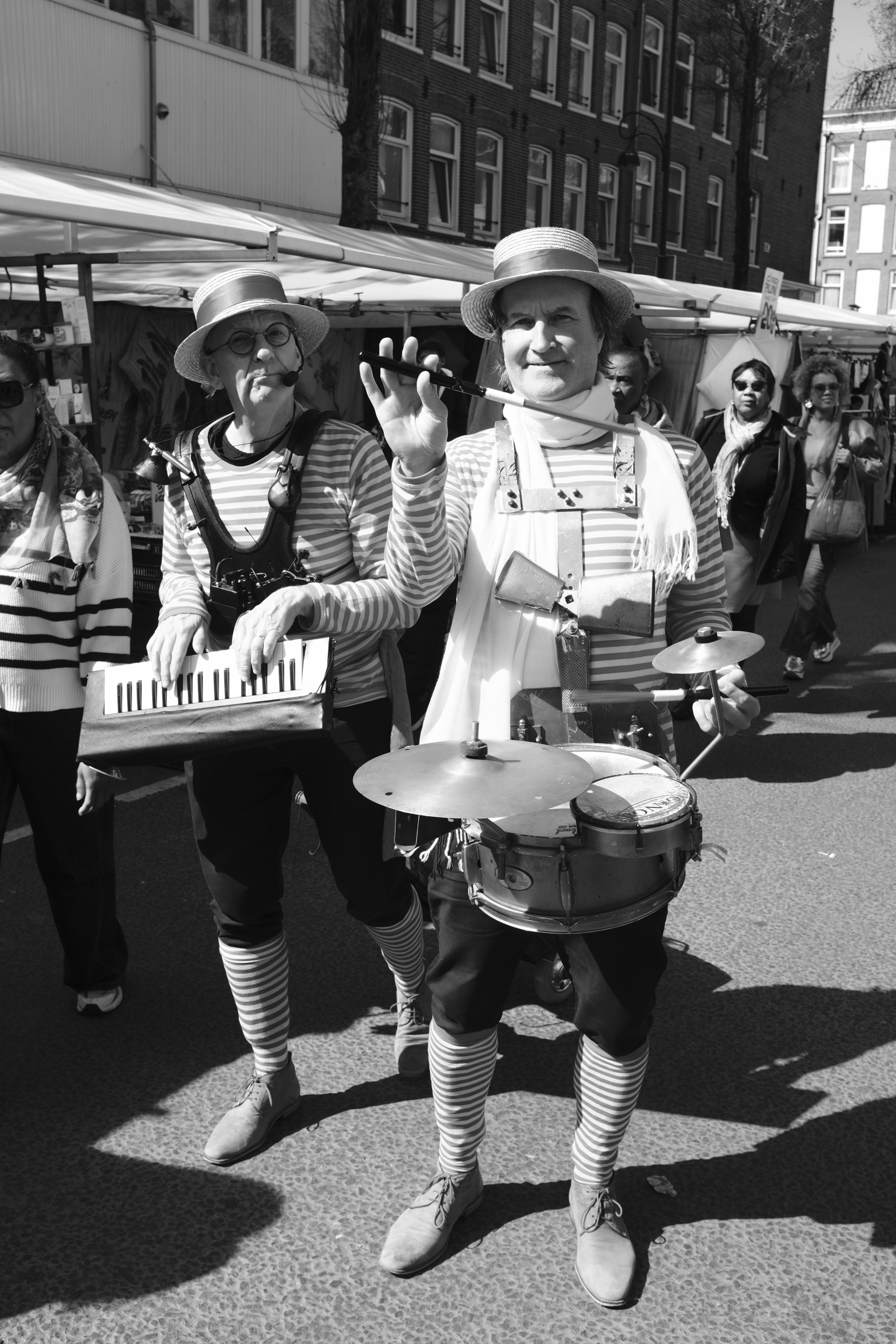 Street Parade Percussionists: A Drummer and Keyboardist in Vintage Stripes