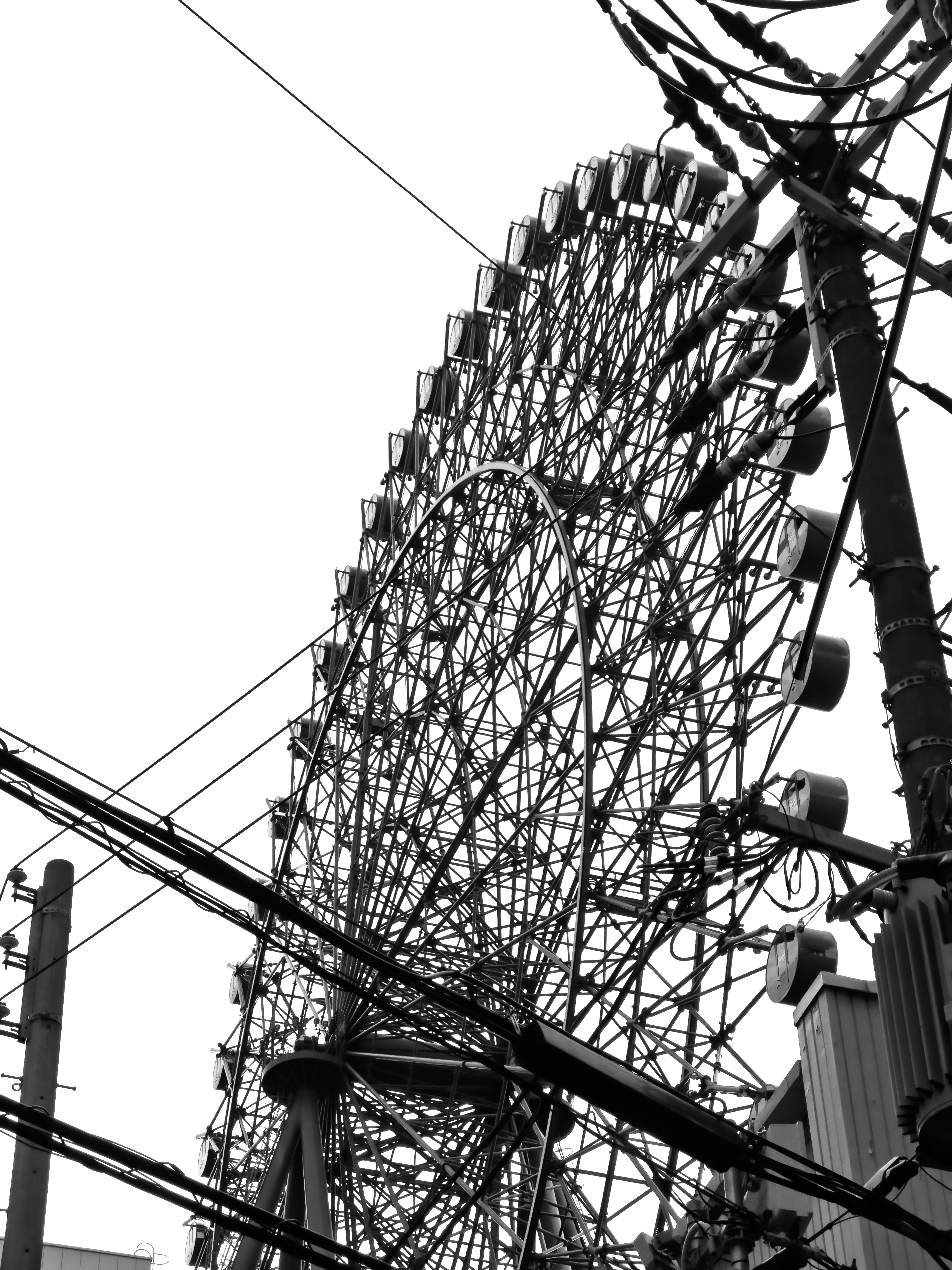 Ferris Wheel Silhouette: Network of Wires and Steel