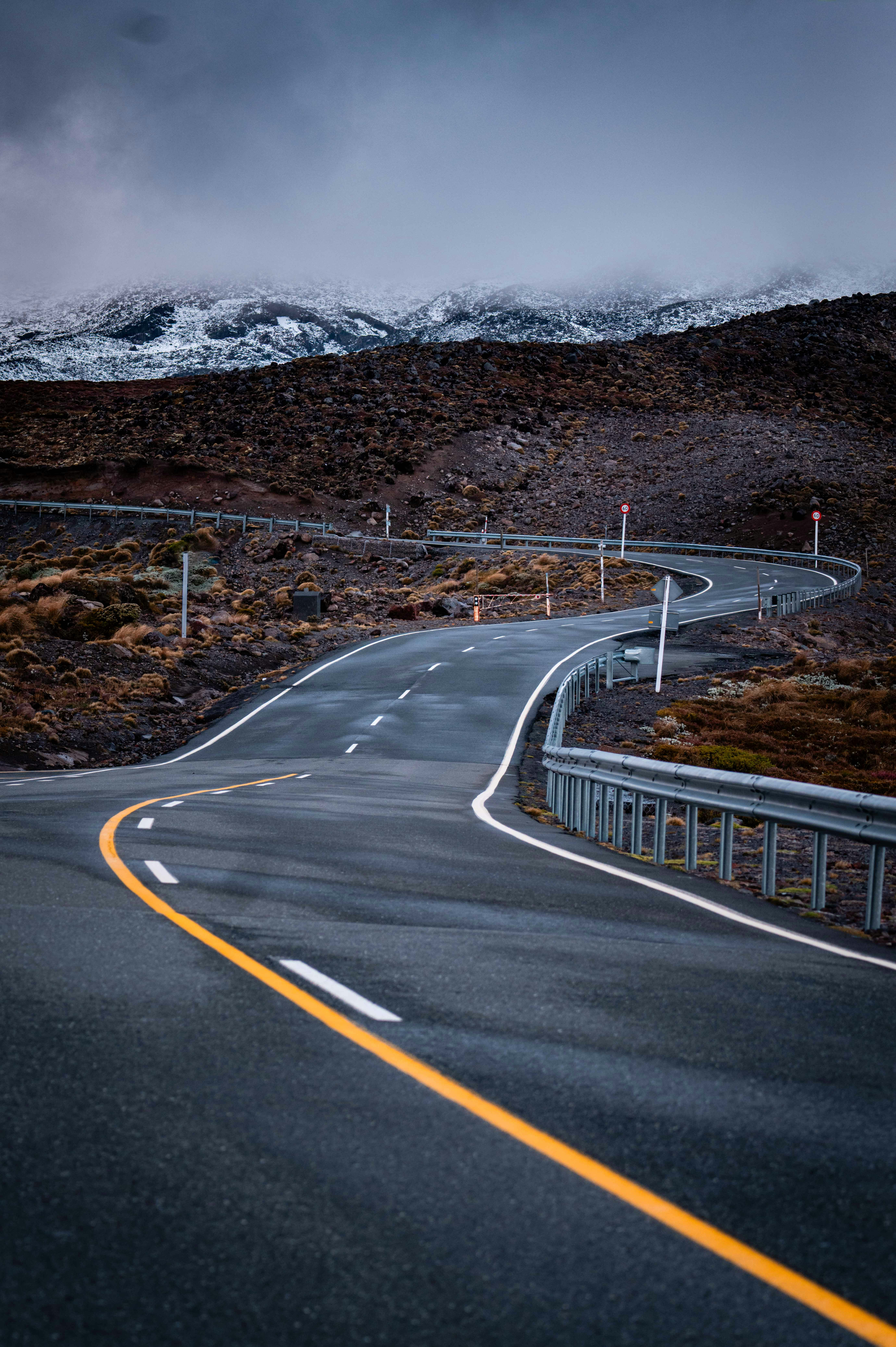 Winding Summit: A Desert Road Carves Through Volcanic Terrain