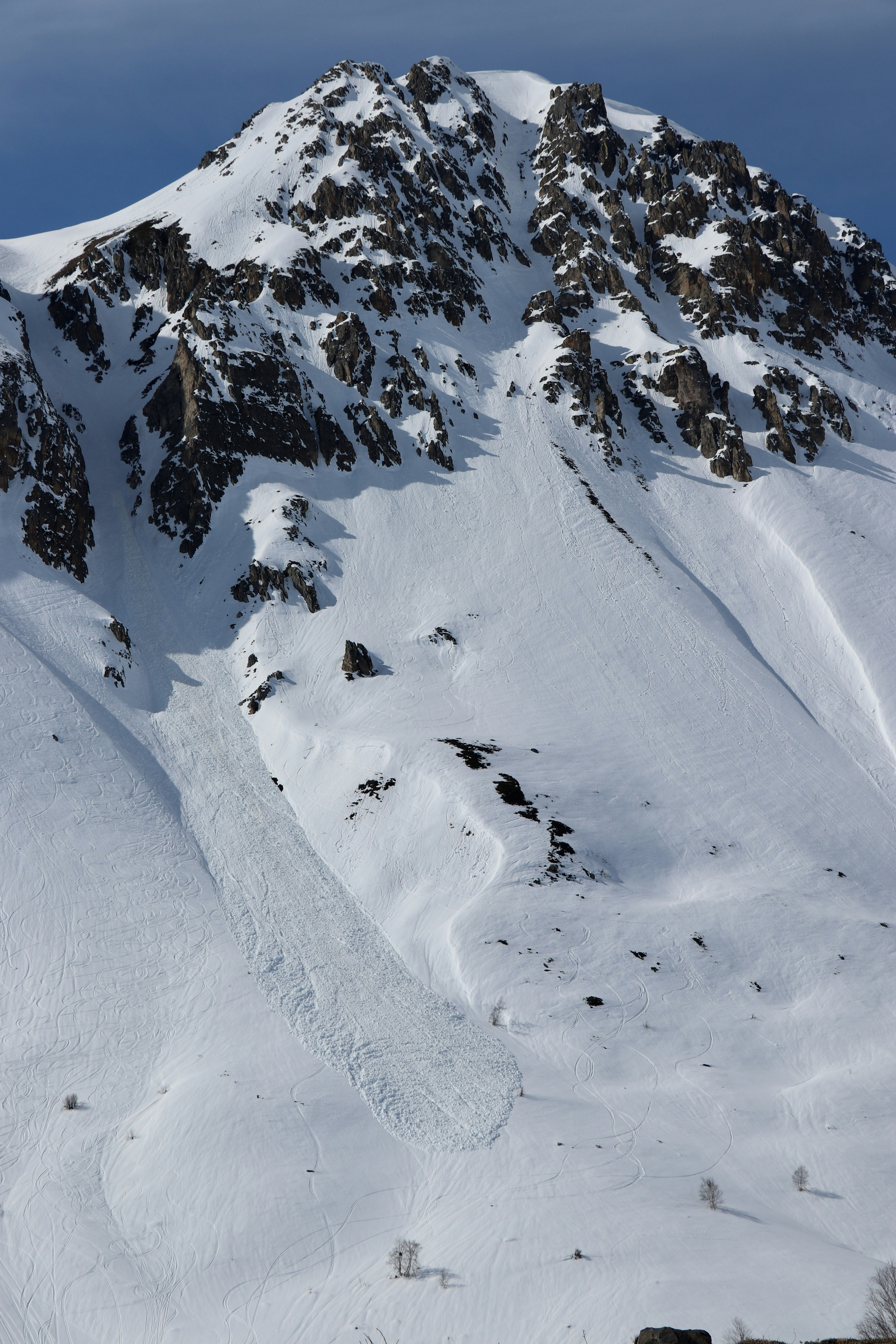 Snow-clad Alpine Ridge under a Clear Blue Sky