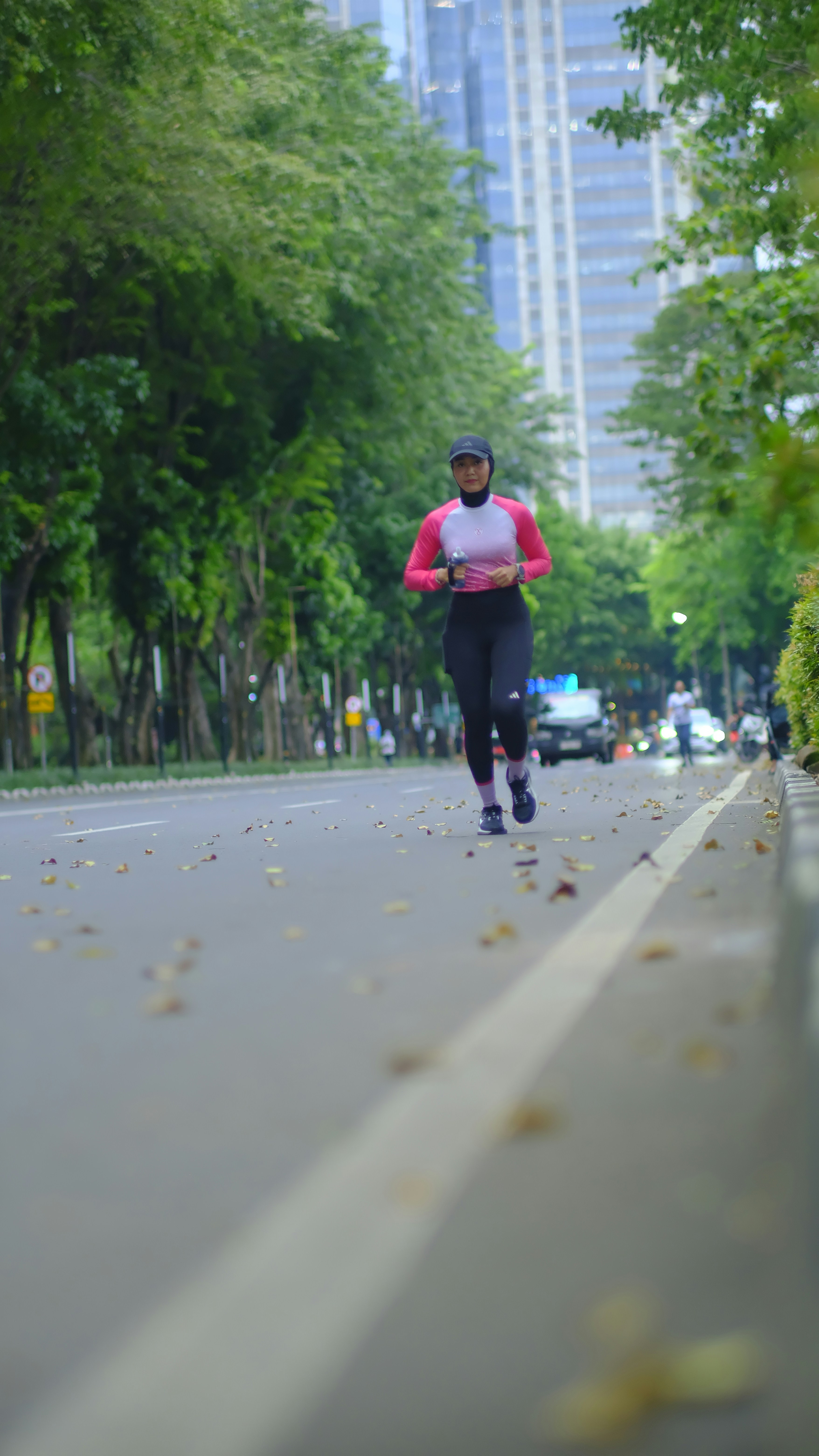 Runner Awakens the Sunlit Avenue
