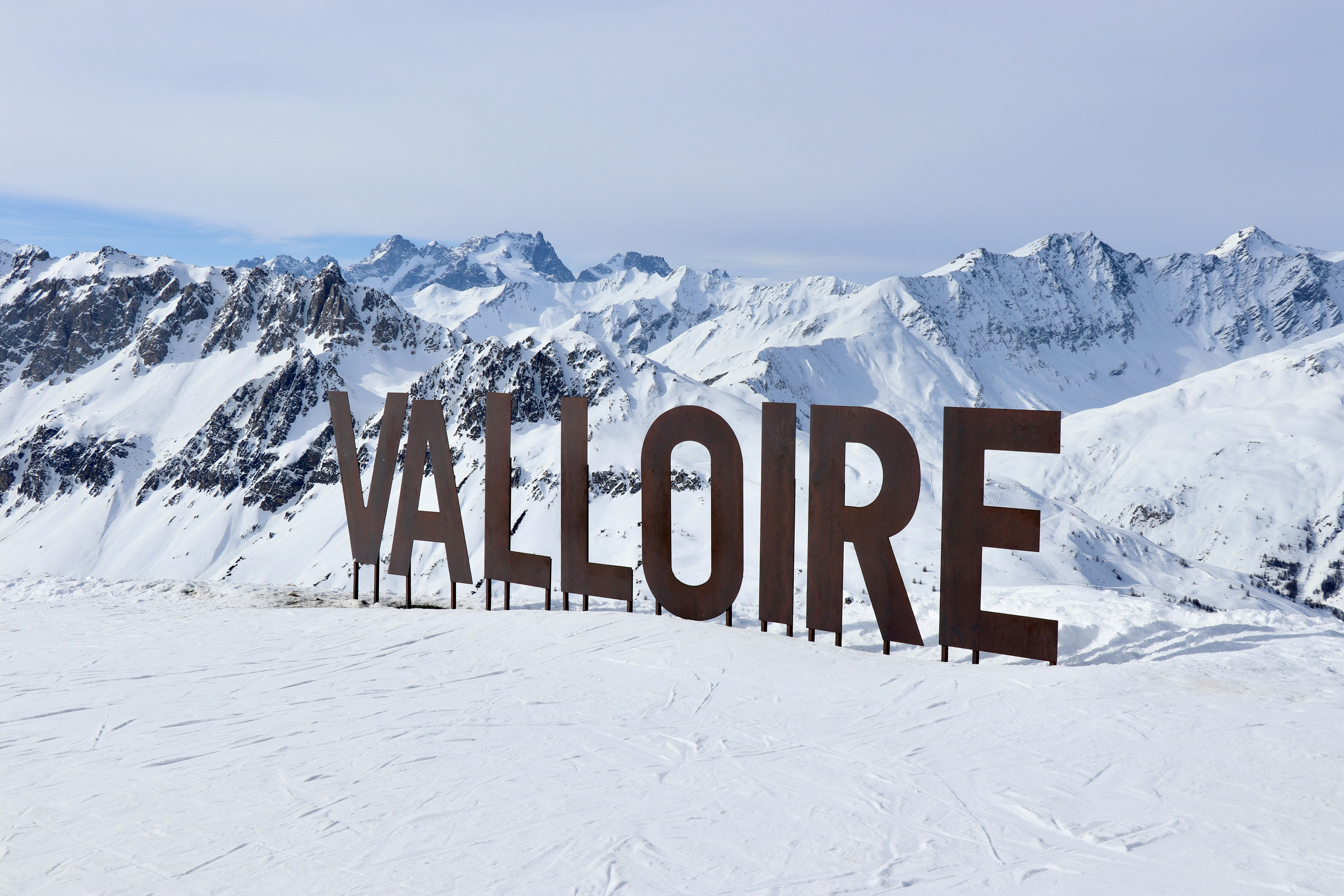 Valldem mountain snow field with oversized 'VALLOIRE' sculpture