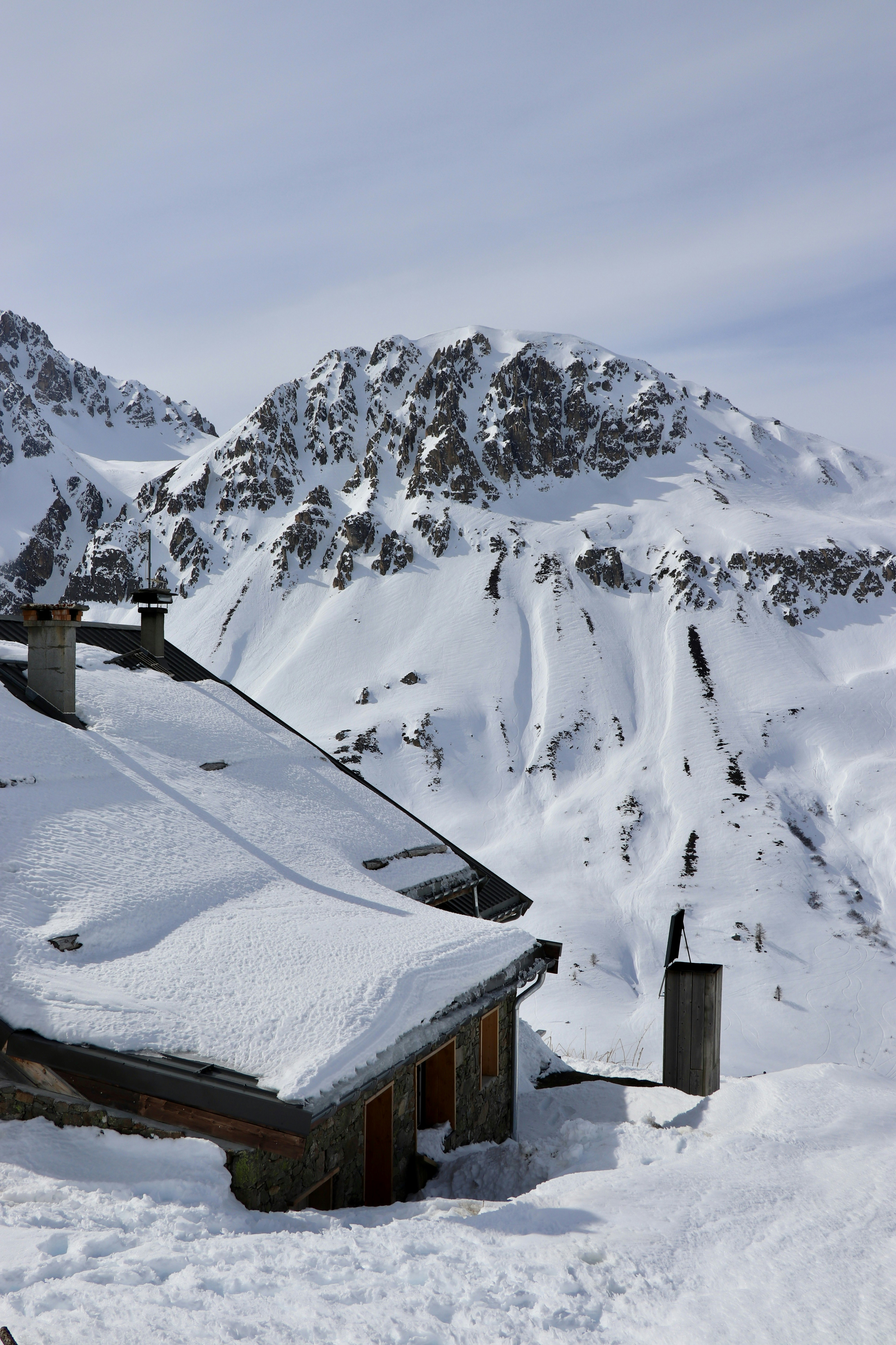 Snowbound Chalet Beneath Jagged Peaks