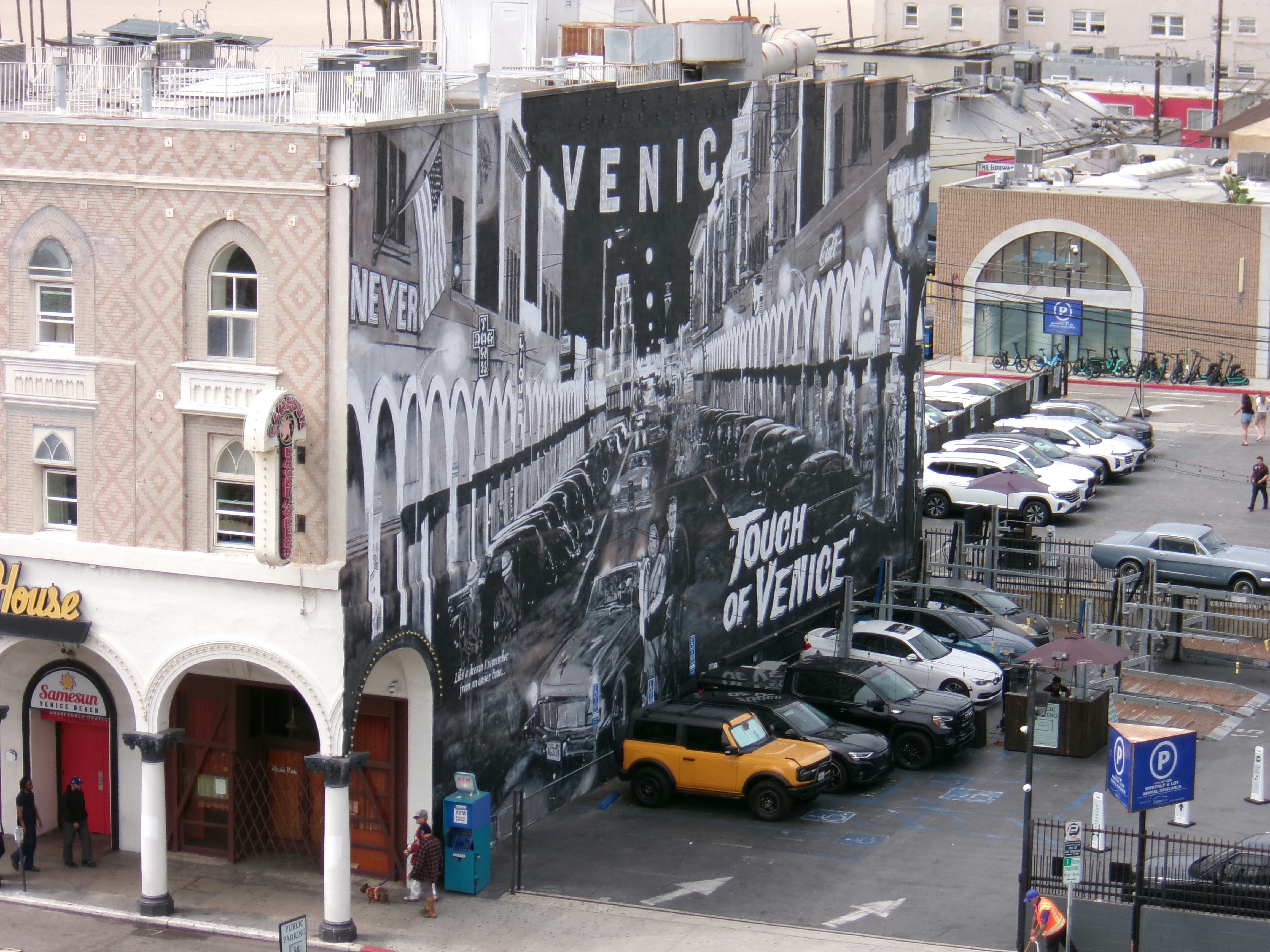 City Wall Maze: A Monochrome Mural Overlooking a Busy Lot
