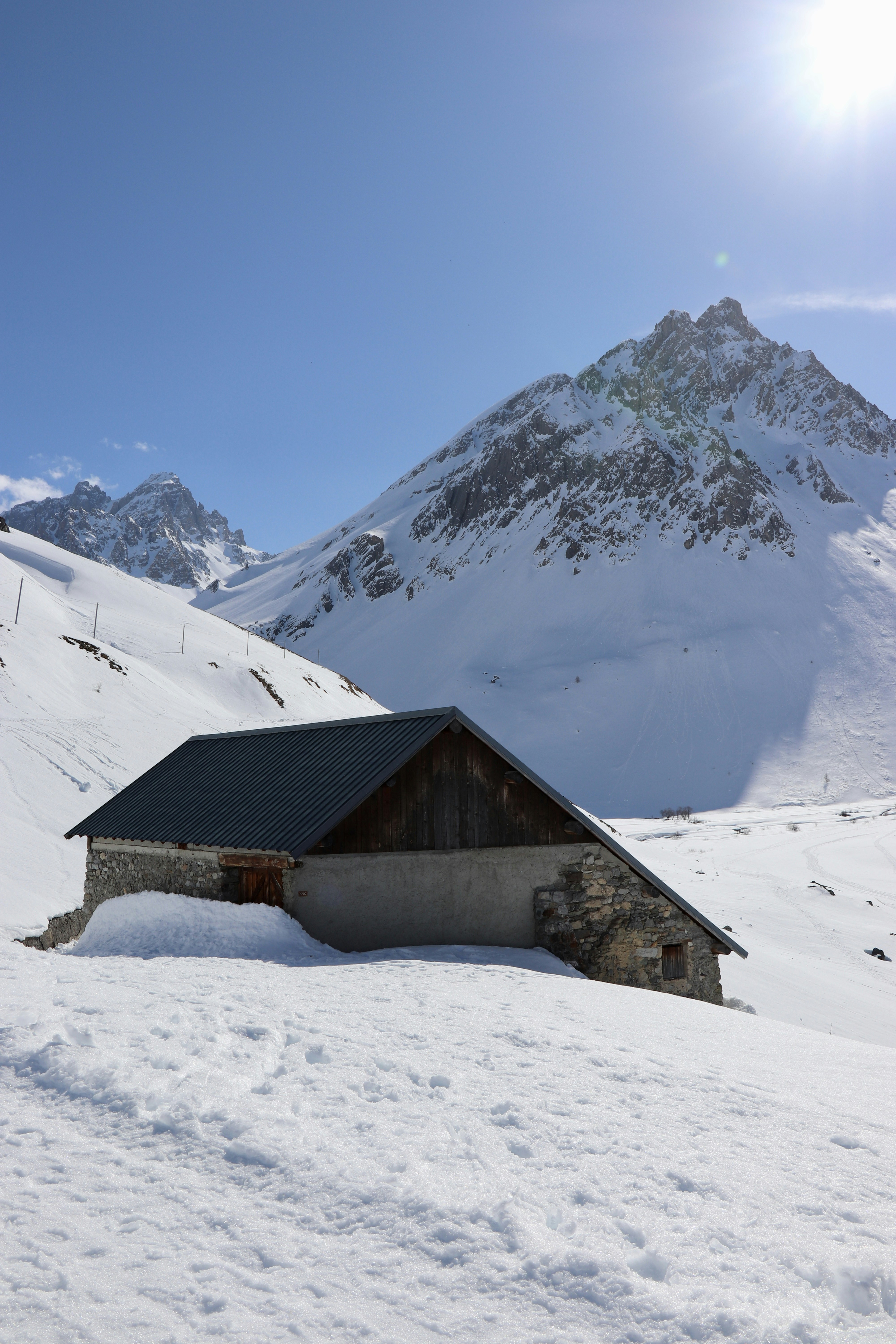 Snowbound Chalet Beneath a Ignited Peak