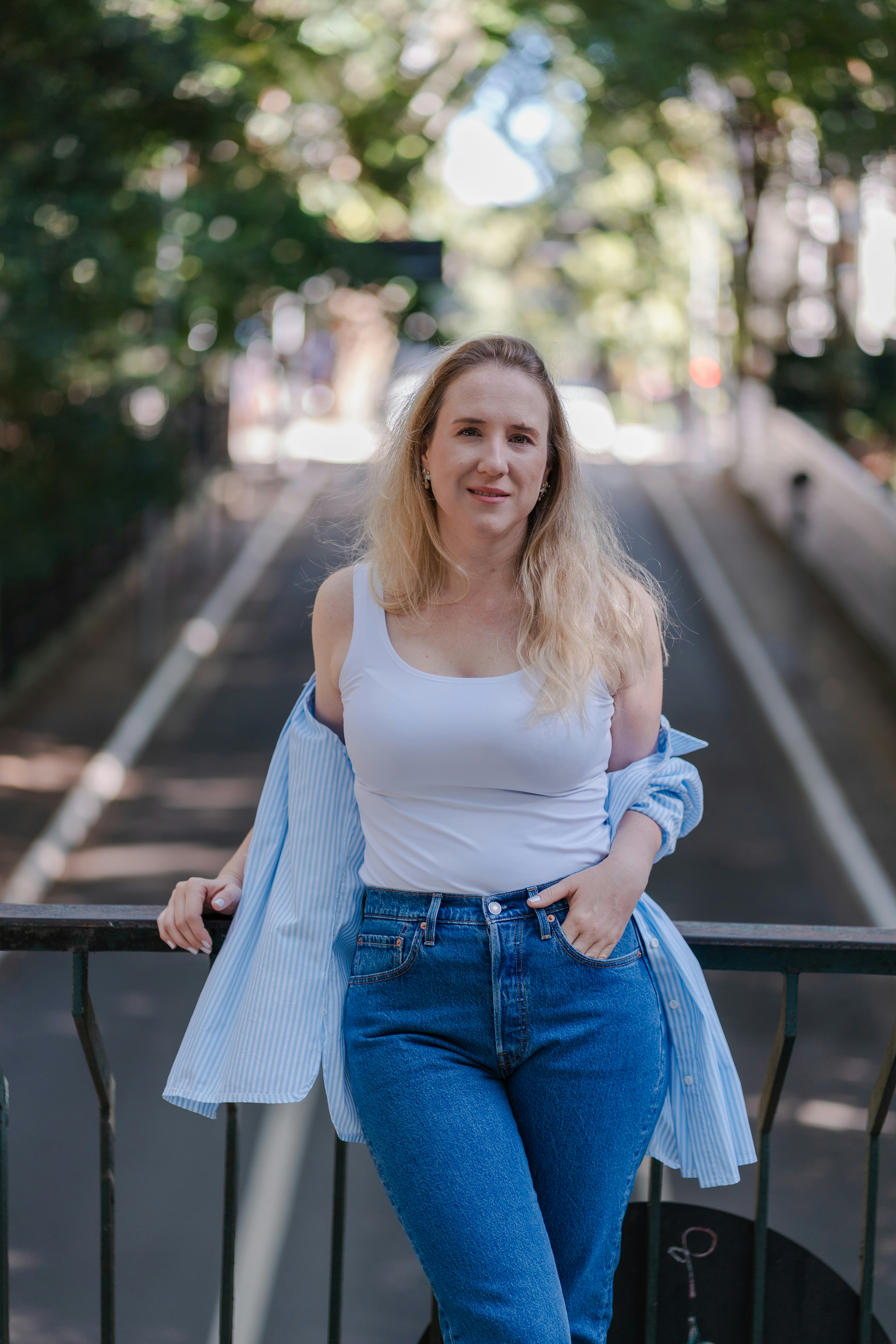 Sunlit Confidence on a Bridge