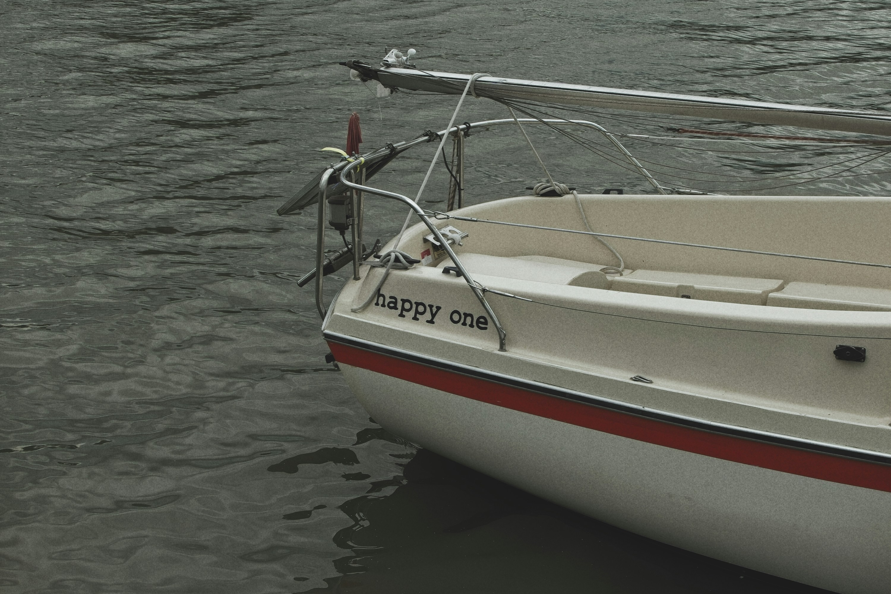 Bow of the Calm Boat with Red Stripe and Handwritten Name