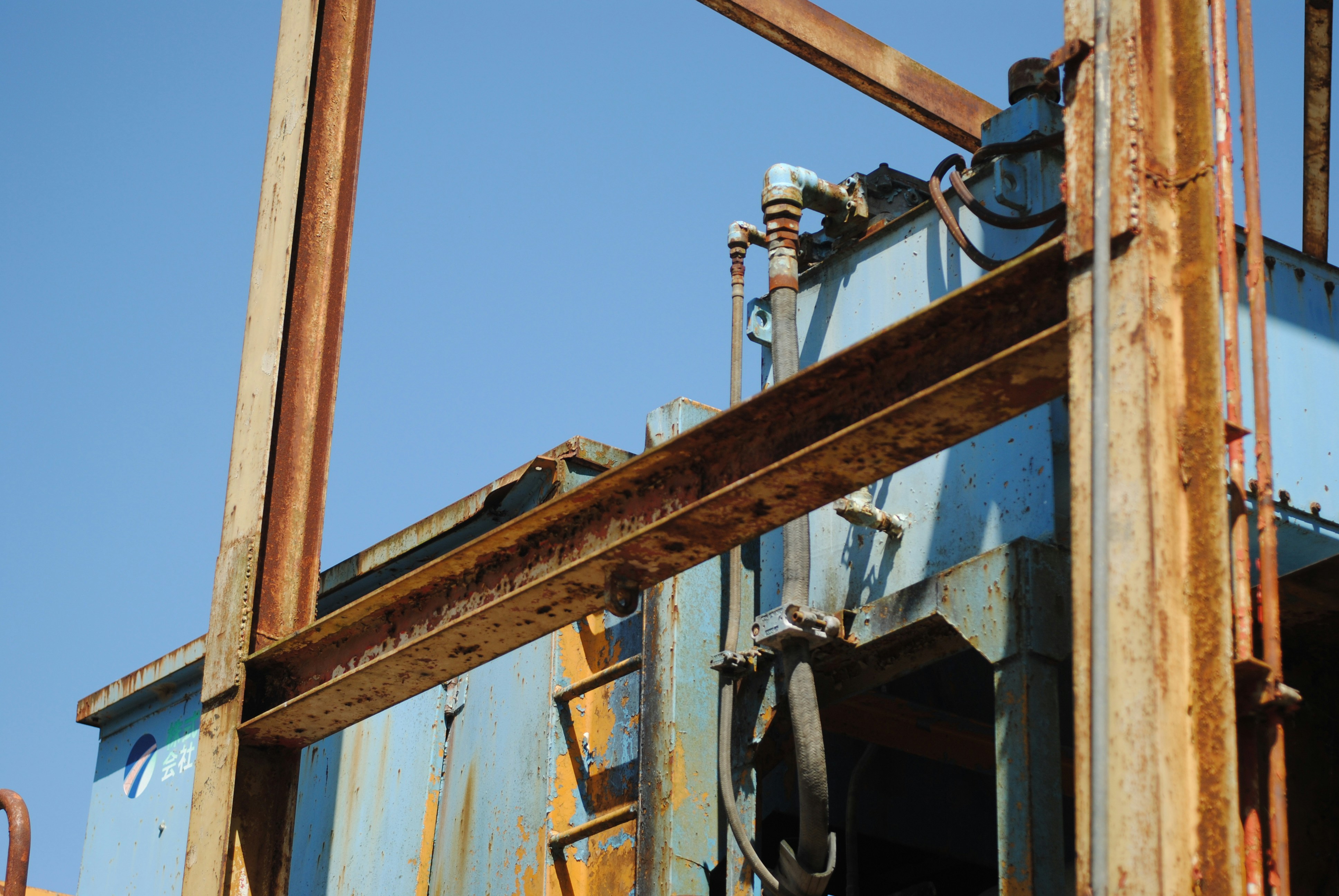 Rust and Structure: A Solitary Frame in Blue Steel