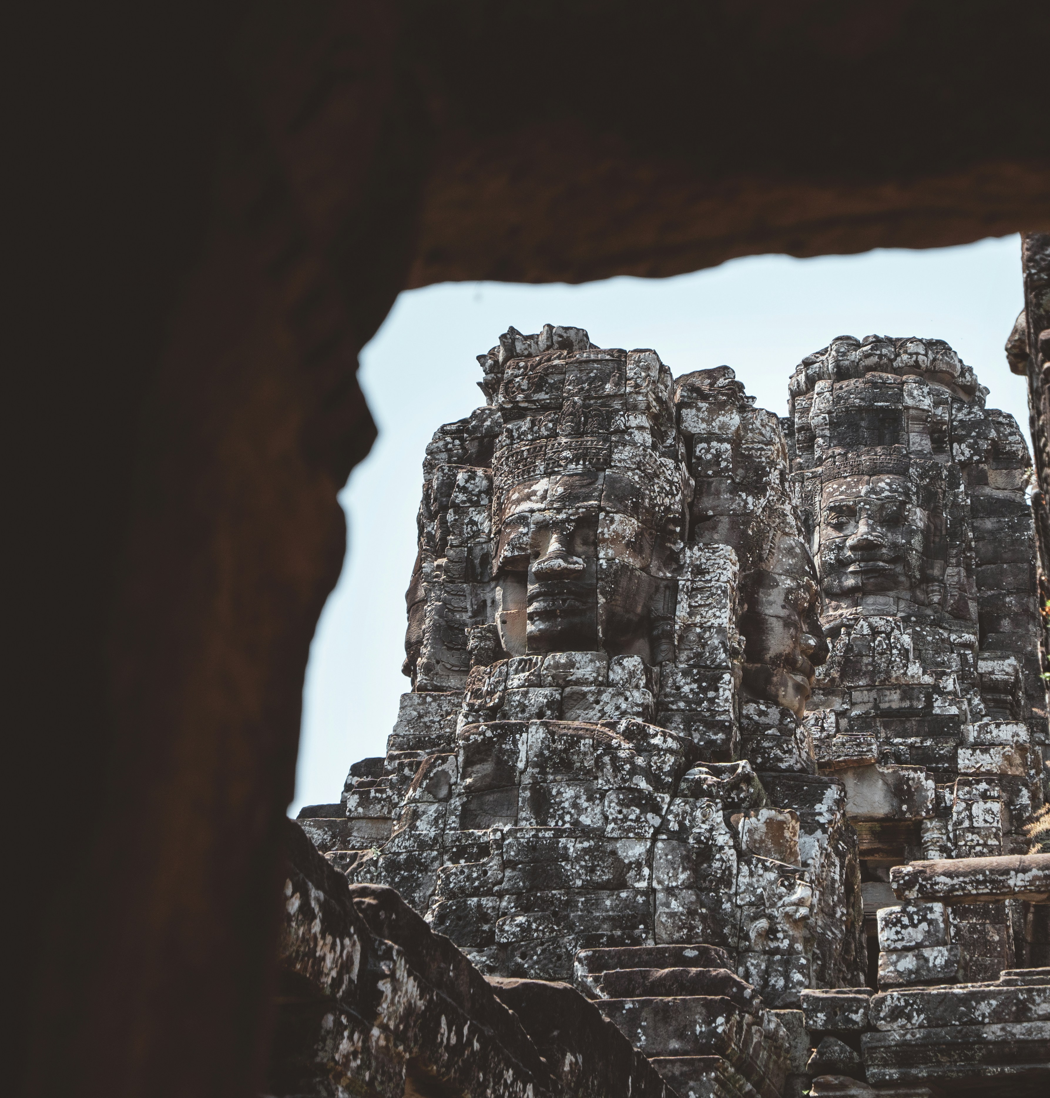 Stone Faces Rising Through the Cenote of Time