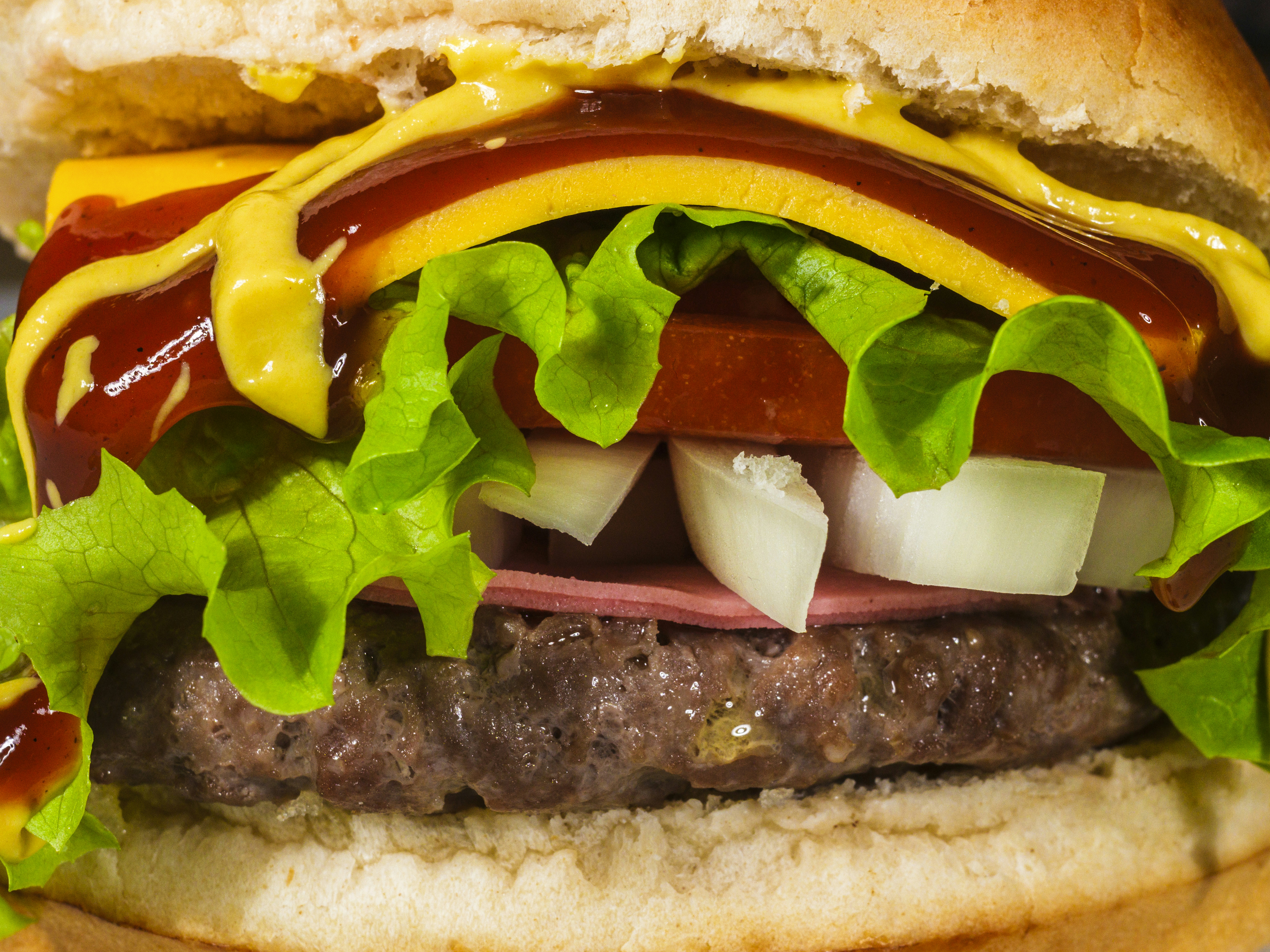 Juicy Quarter-Pounder under a Garden of Greens