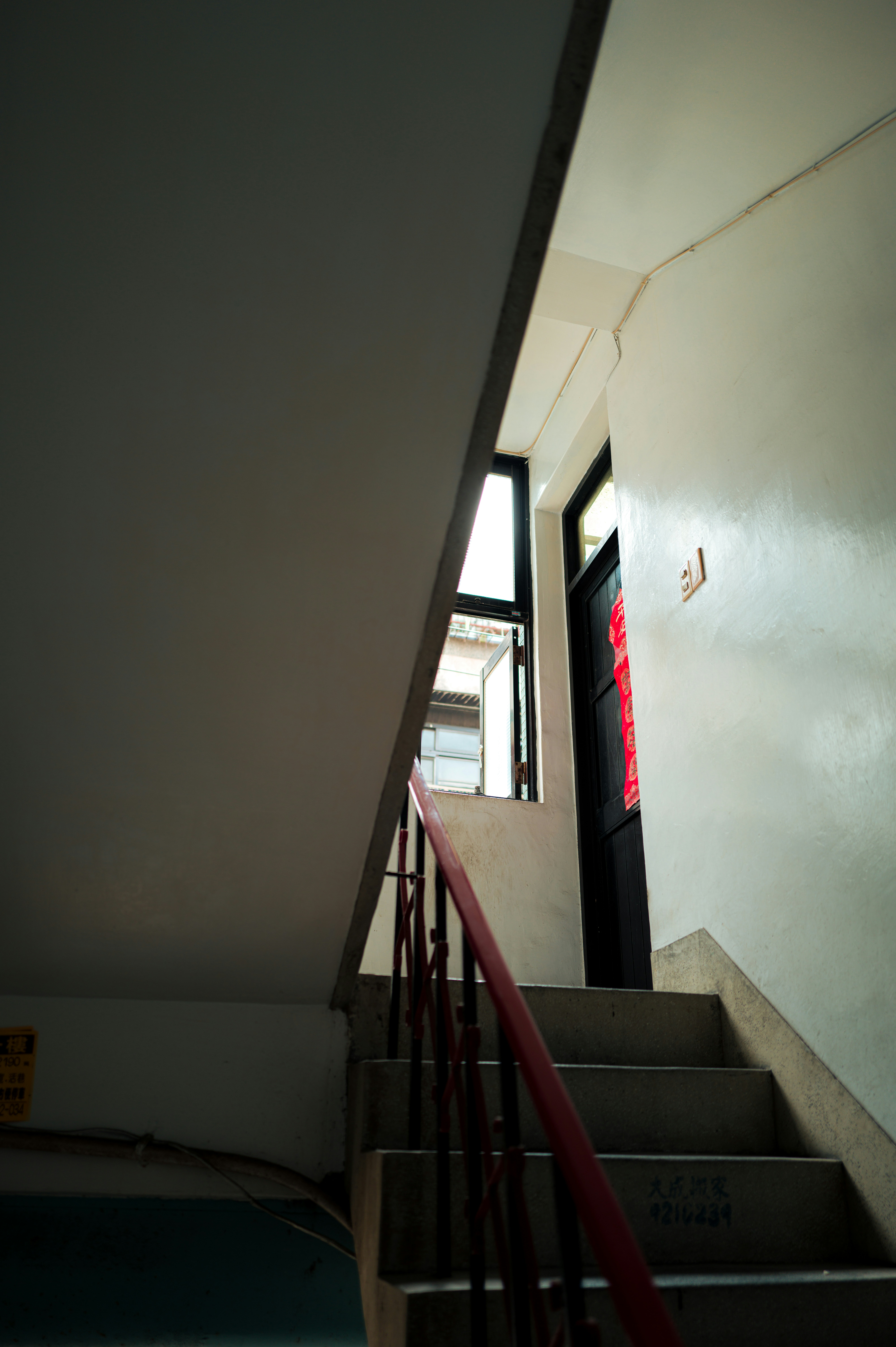 Stairwell to Light: A Quiet Descent Toward an Open Door