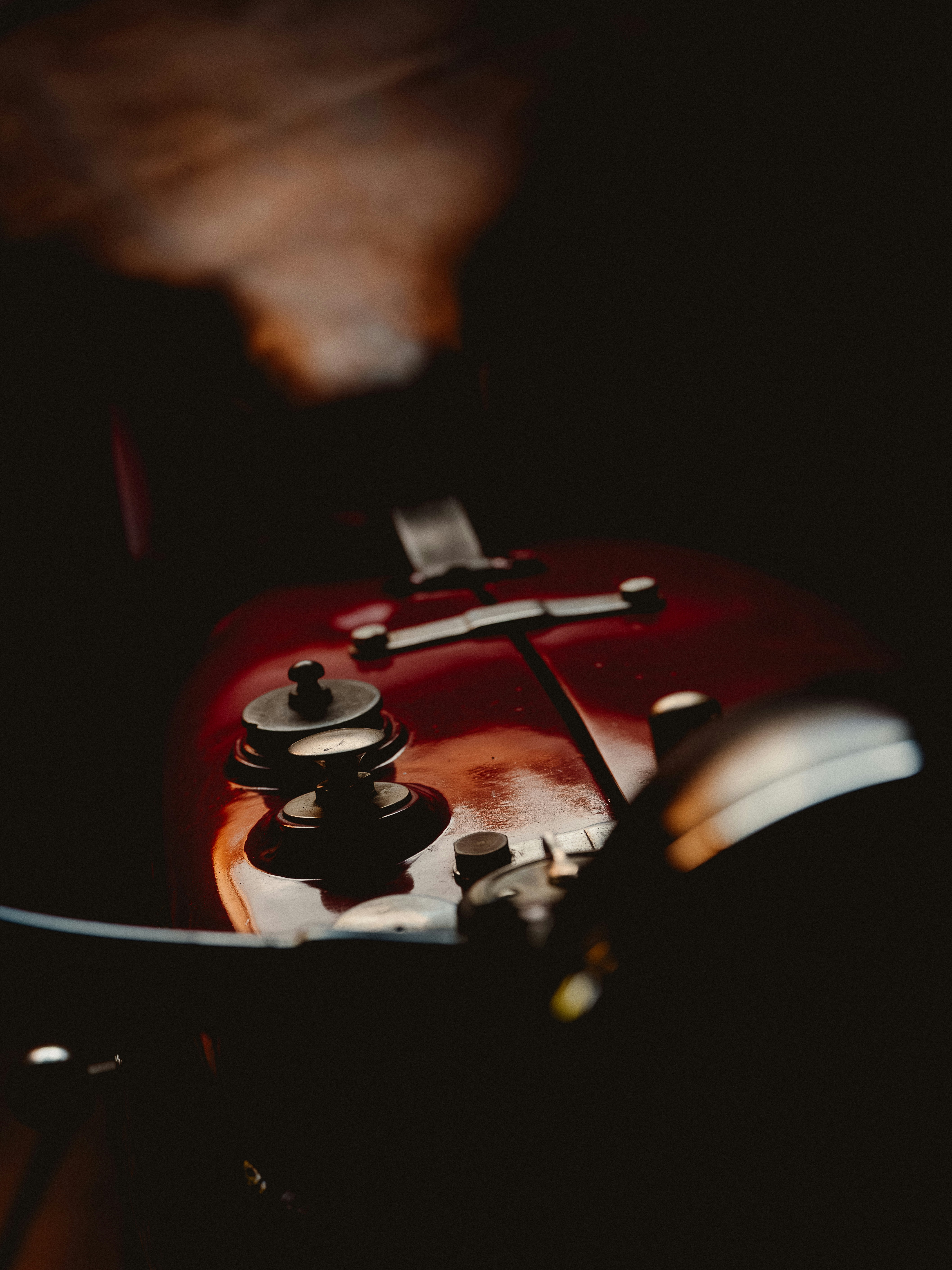 Red Electric: The Carved Smoke Above a Steam-Softened Violin of Metal