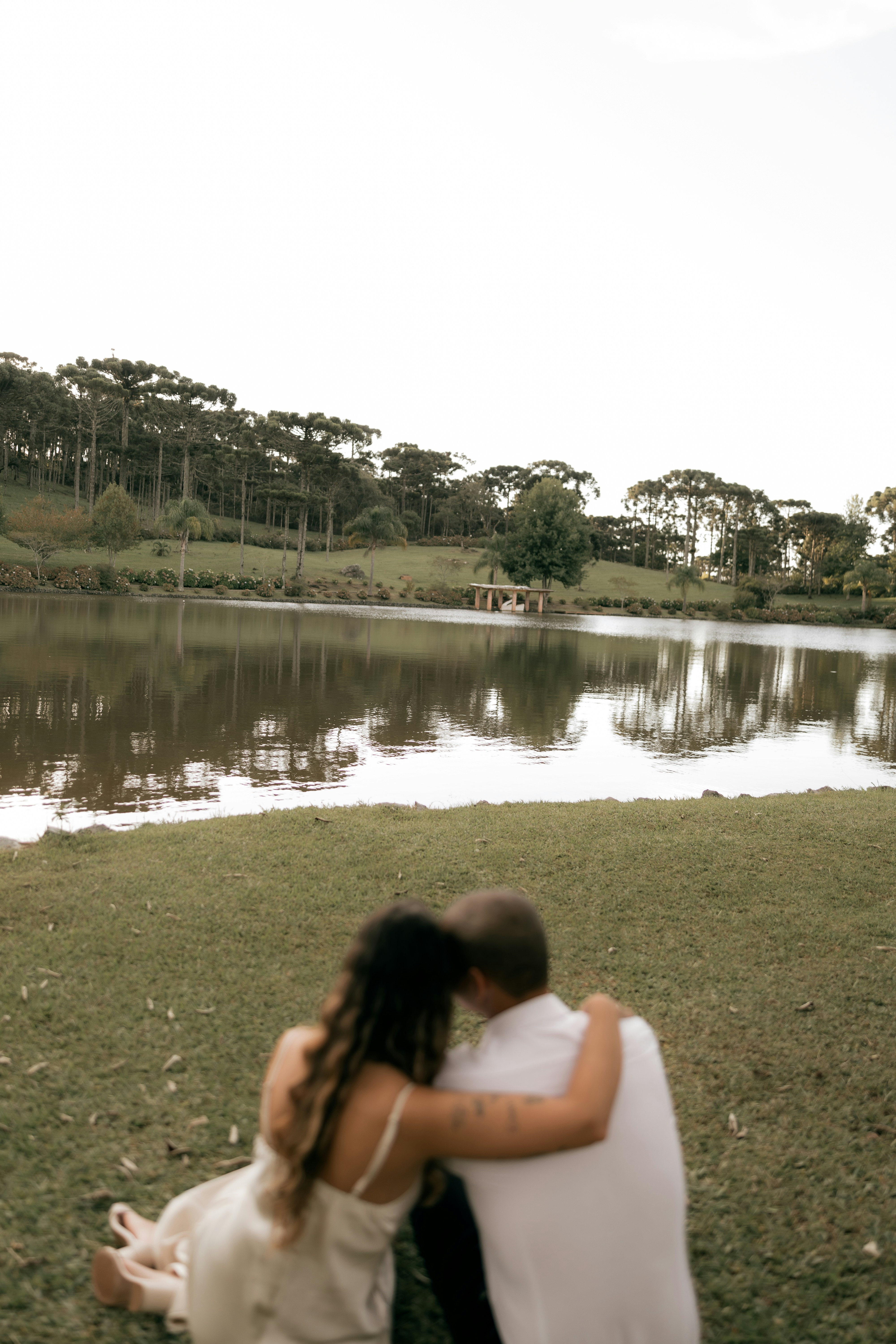 Tender embrace by the lakeside at golden hour