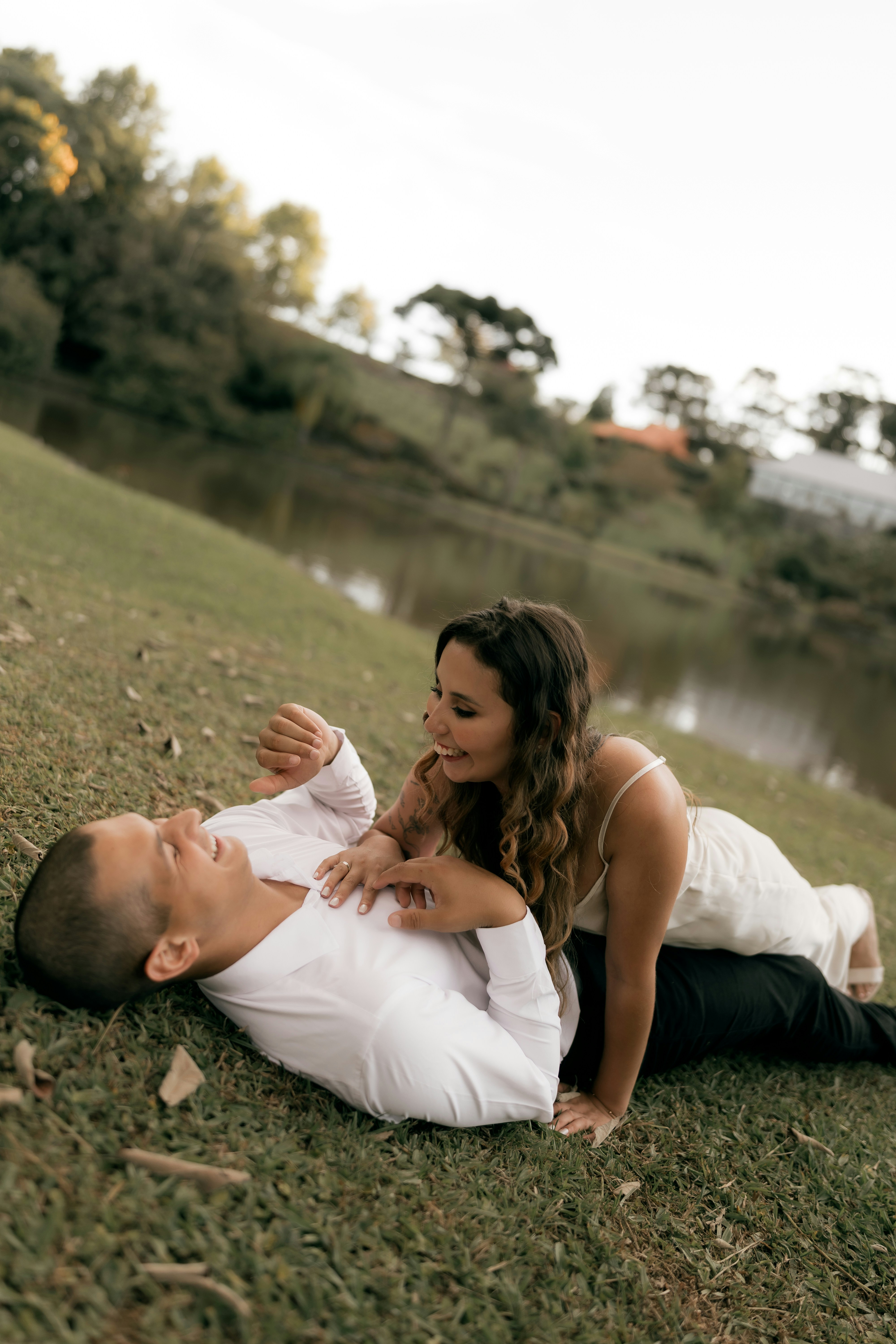 Laughter in the Grass: Intimate Moment by the Lake