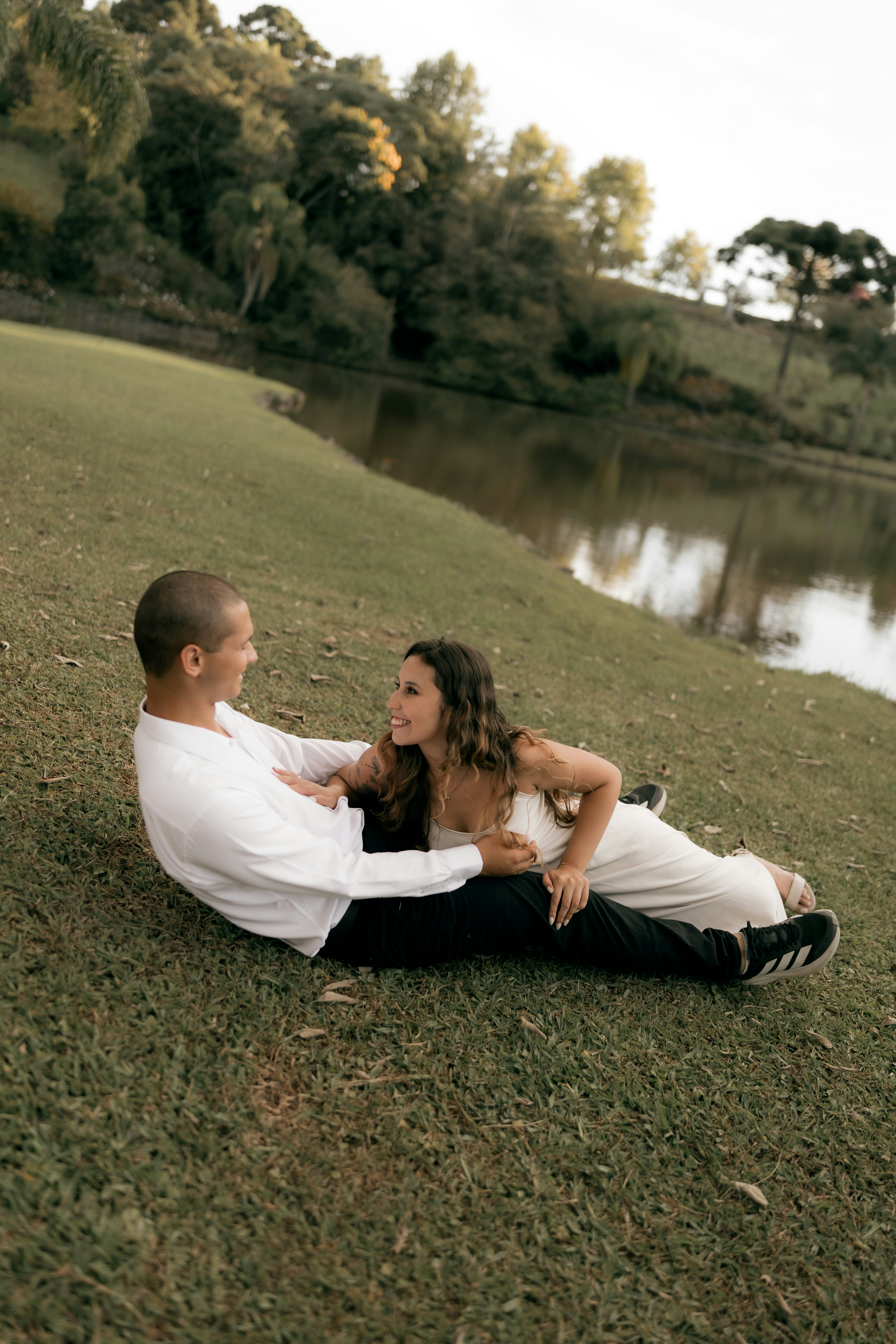 Lovers on the Lakebank: Quiet Conversation Amid Autumn Light