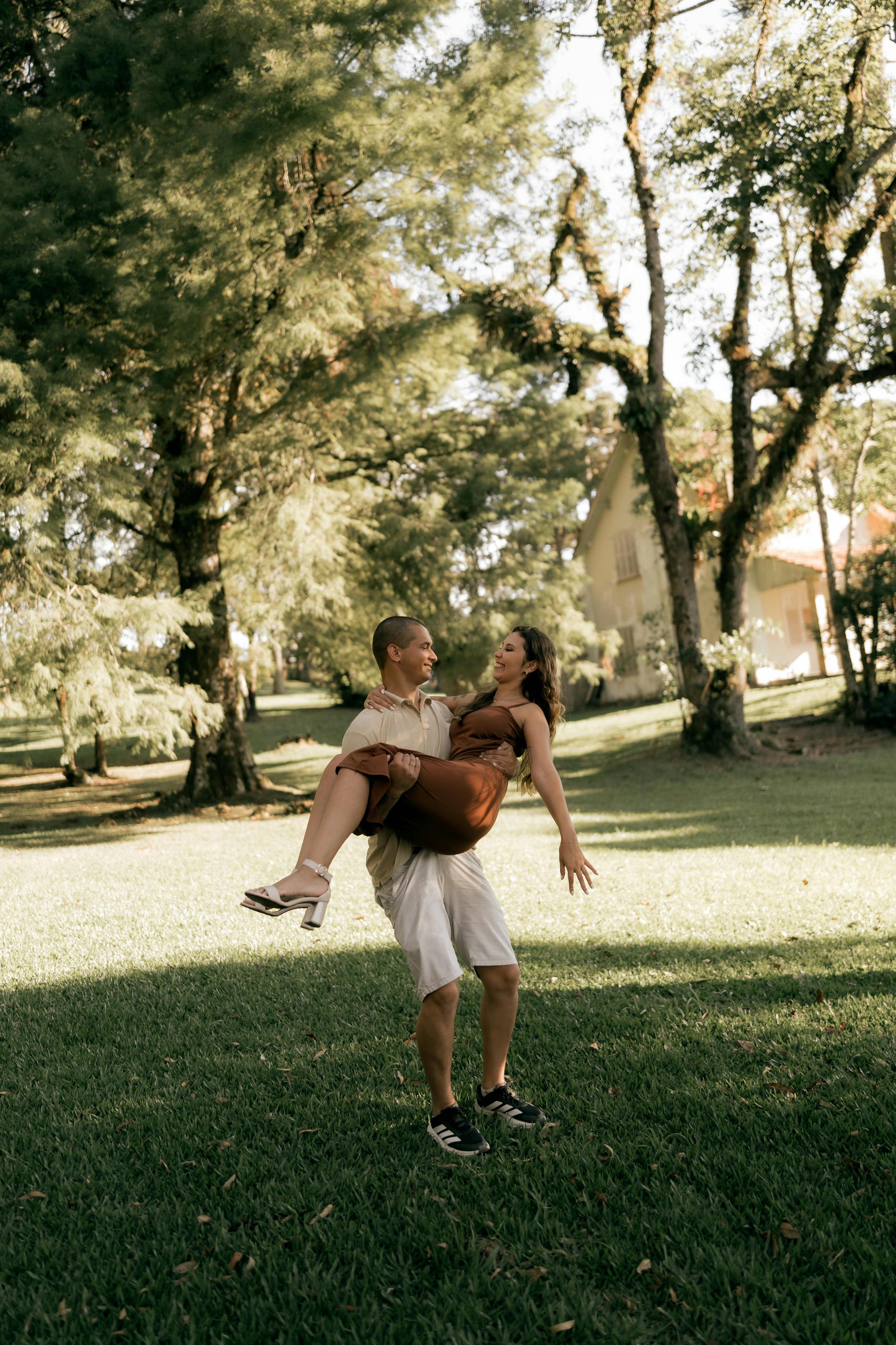 Bright Evening Swing: A Couple in a Sunlit Park