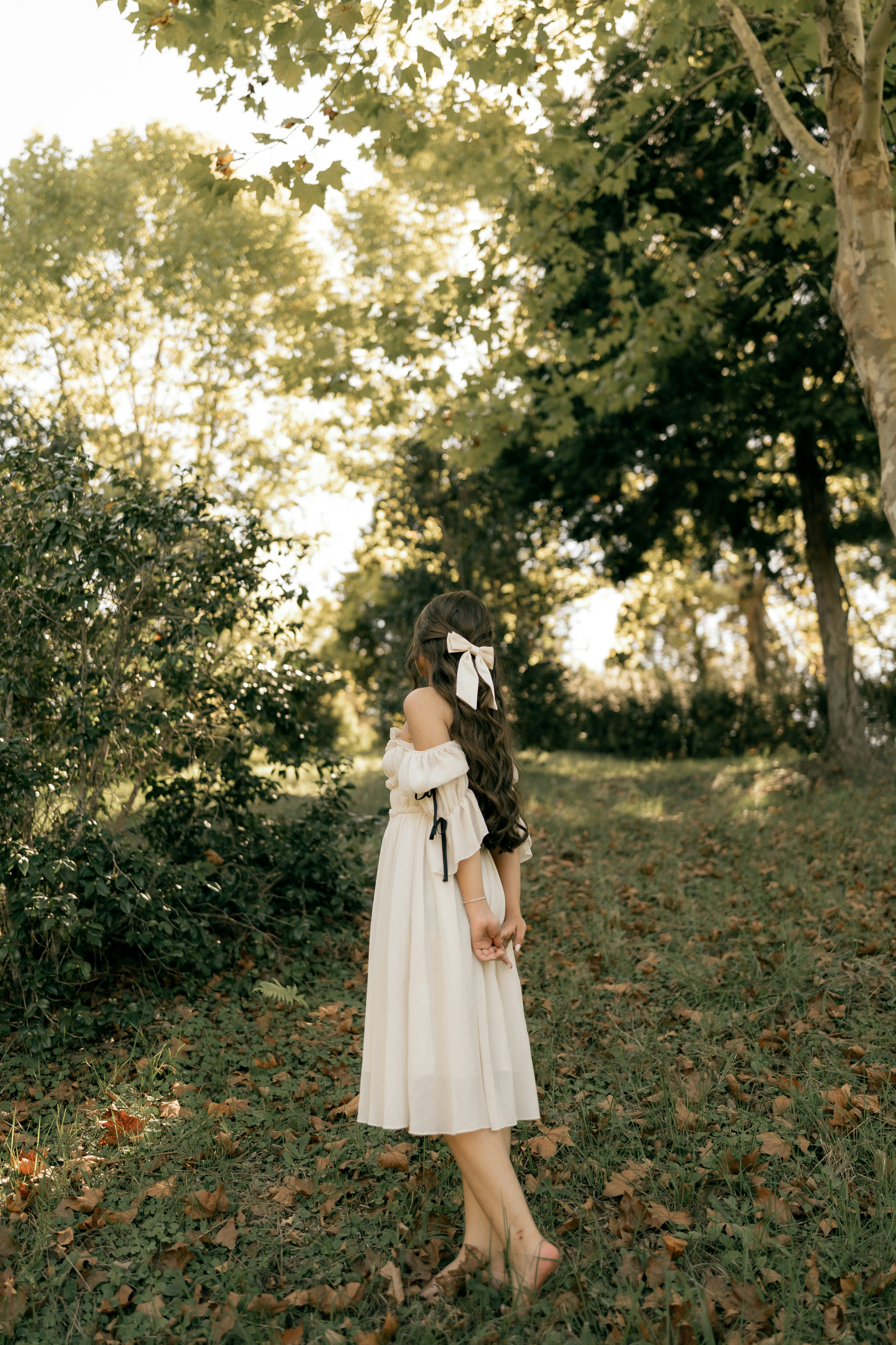 Portrait in the Dappled Park: A Girl in White
