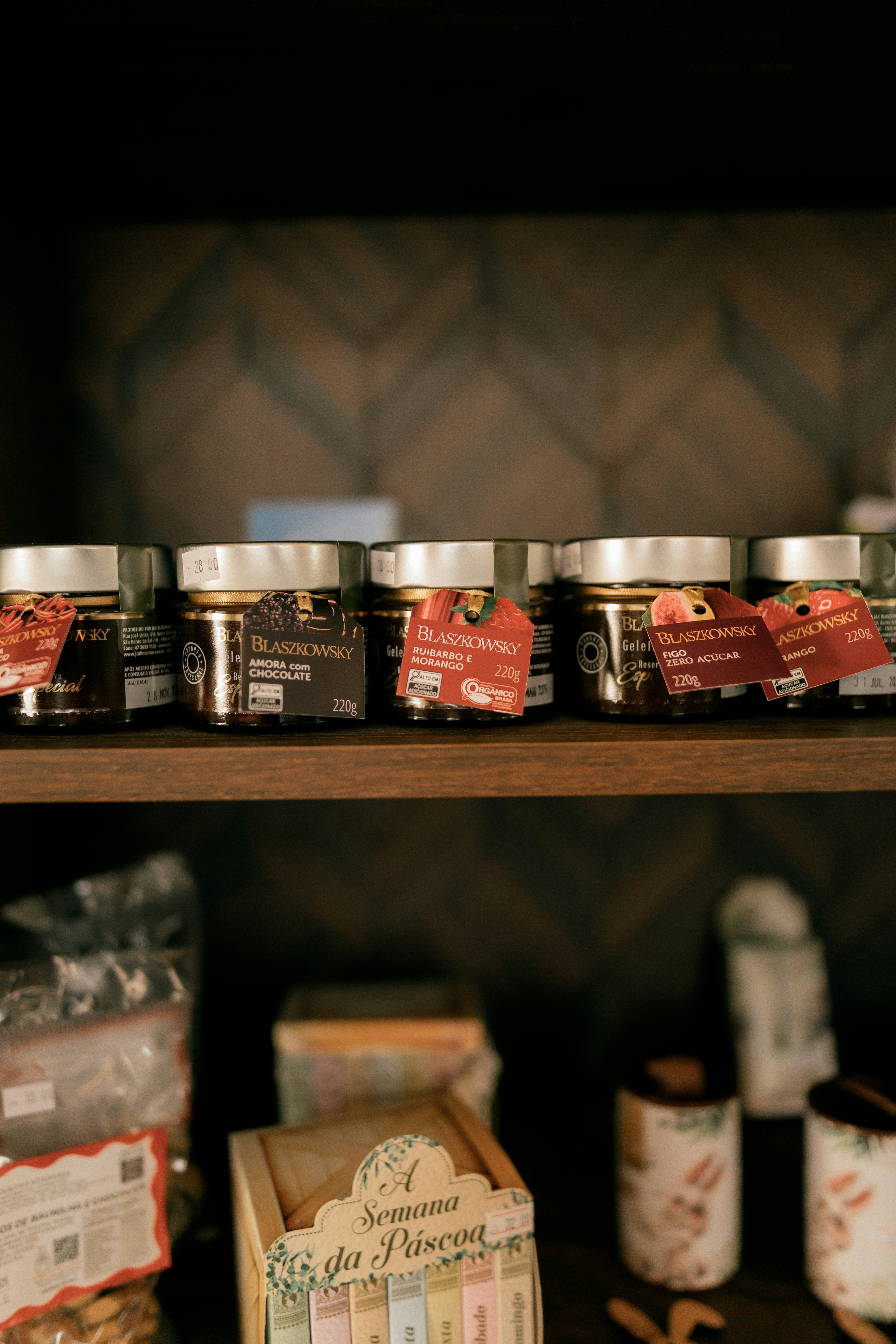 Shelf of Gourmet Jars: Dark Wood, Warm Lighting, Subtle Texture