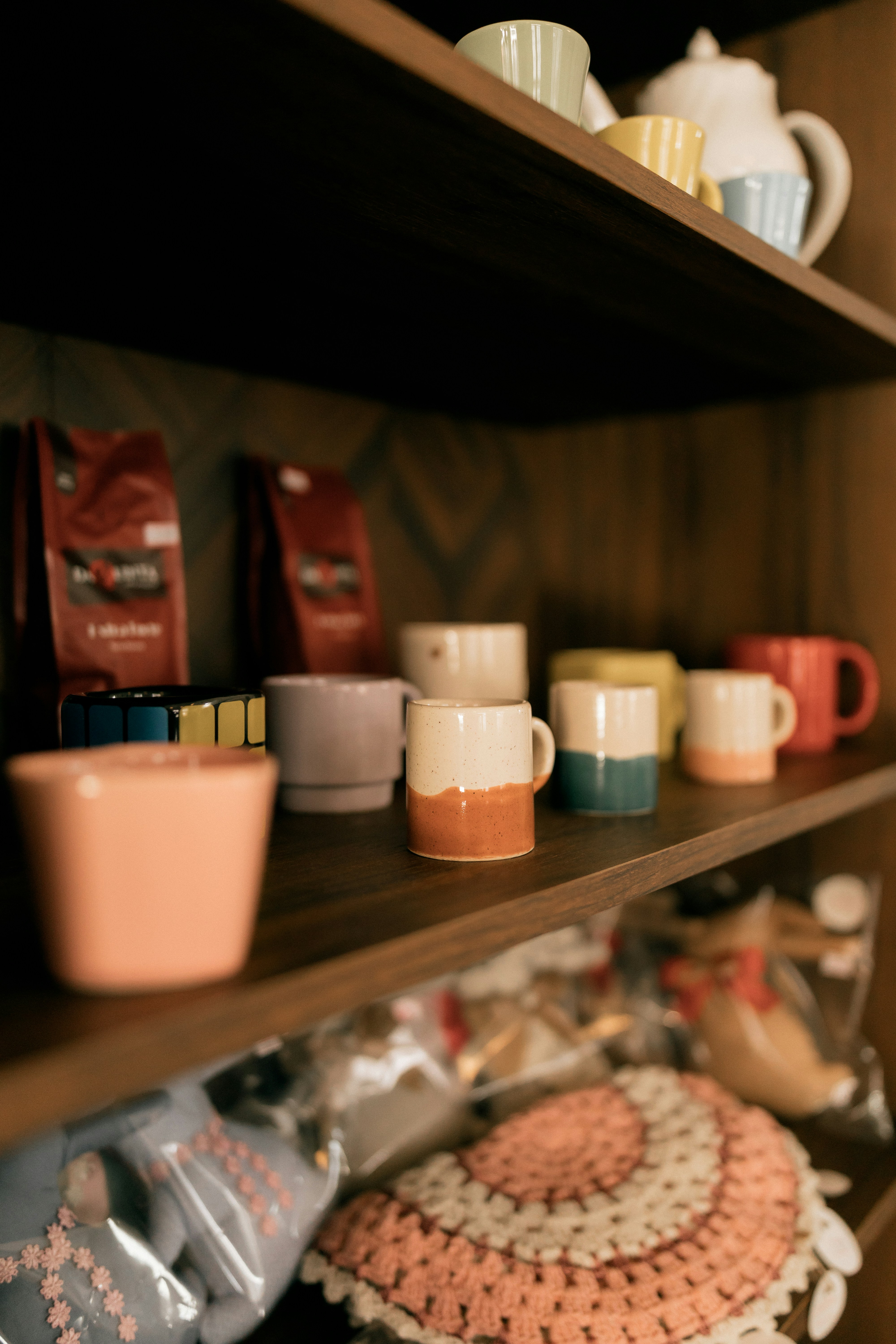 Colorful Kitchen Mugs on A Wooden Shelf