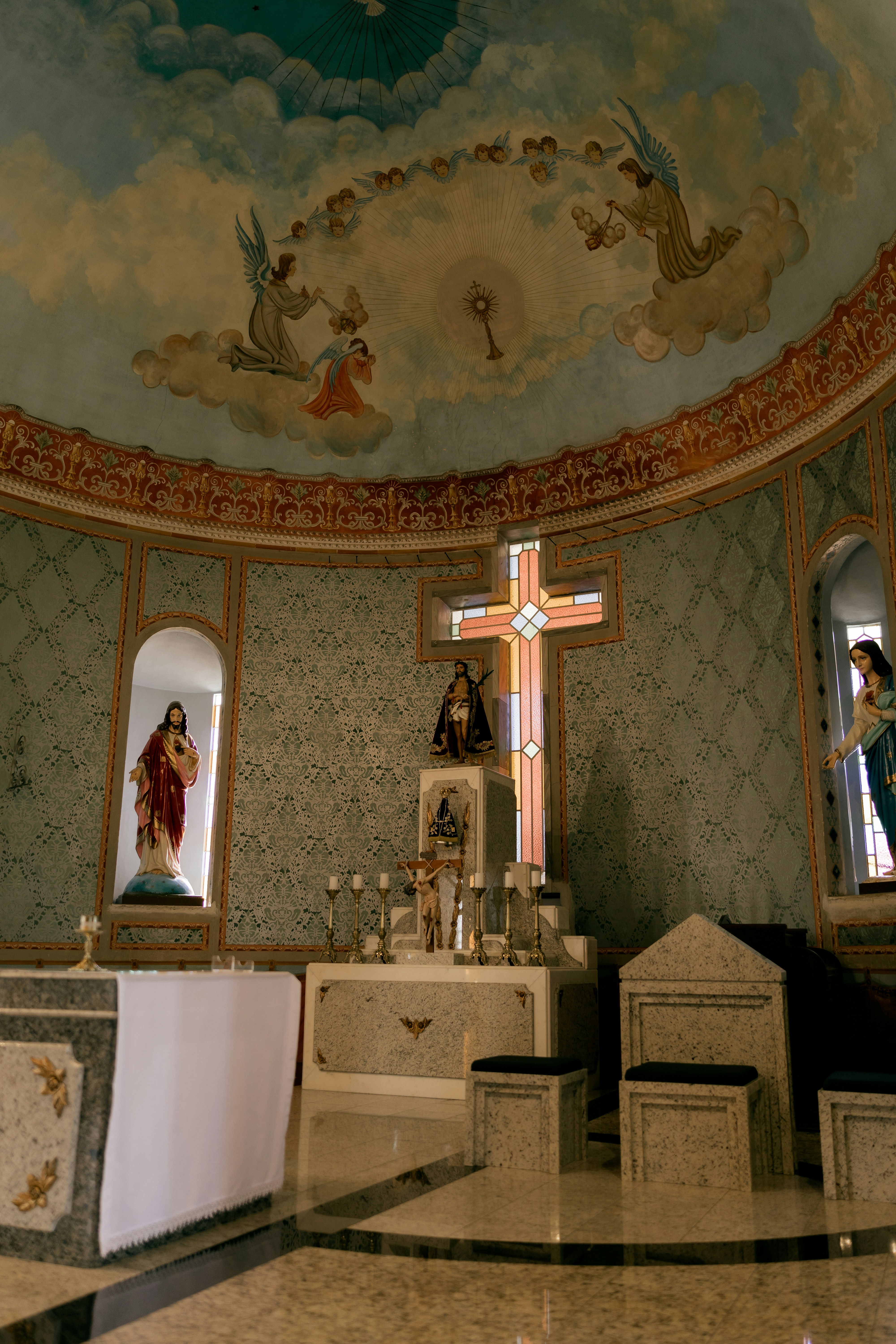 Sanctuary of Light: A Church Interior with Altar and Crowned Cross