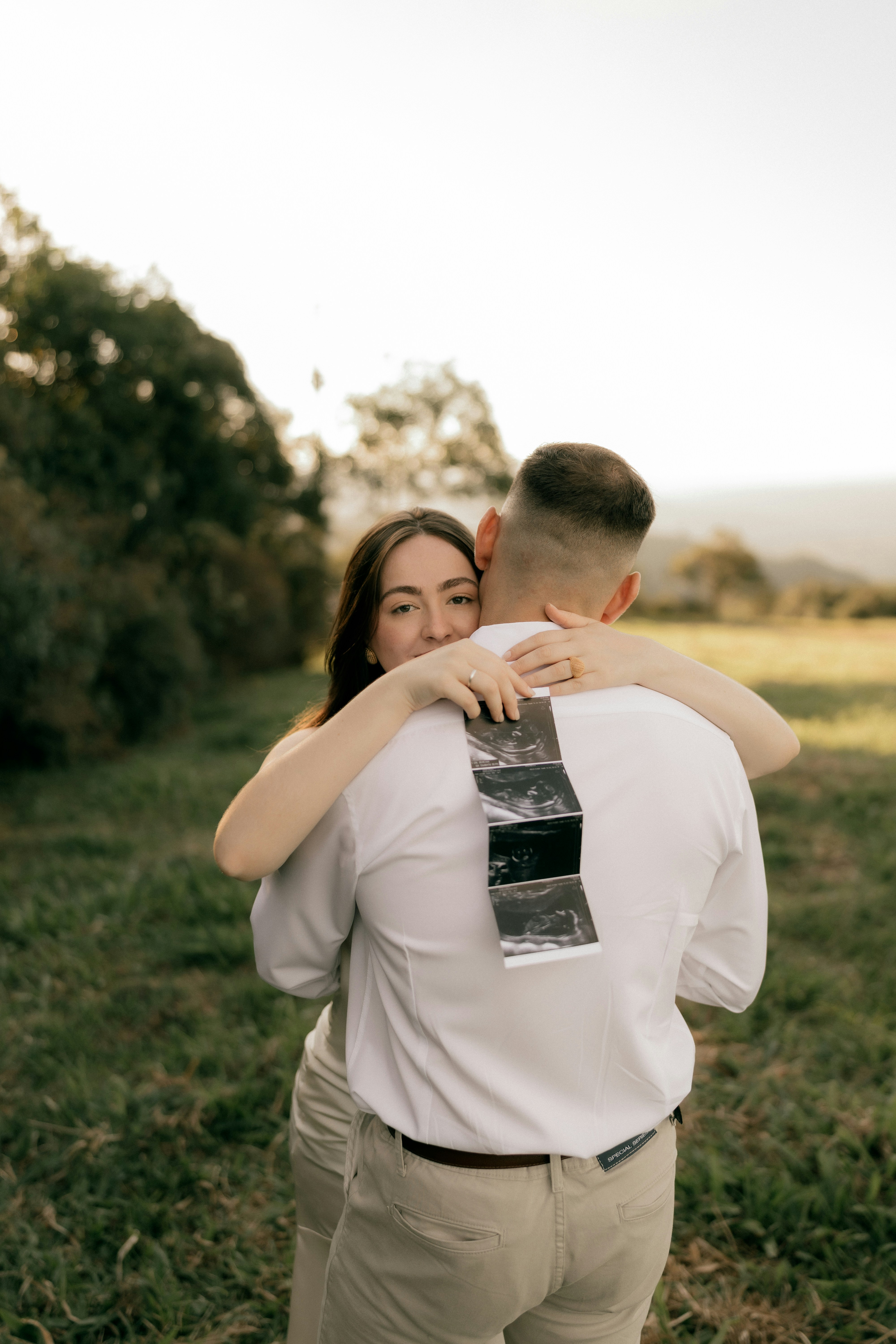 Embrace at Golden Hour: A Quiet Reunion in the Field