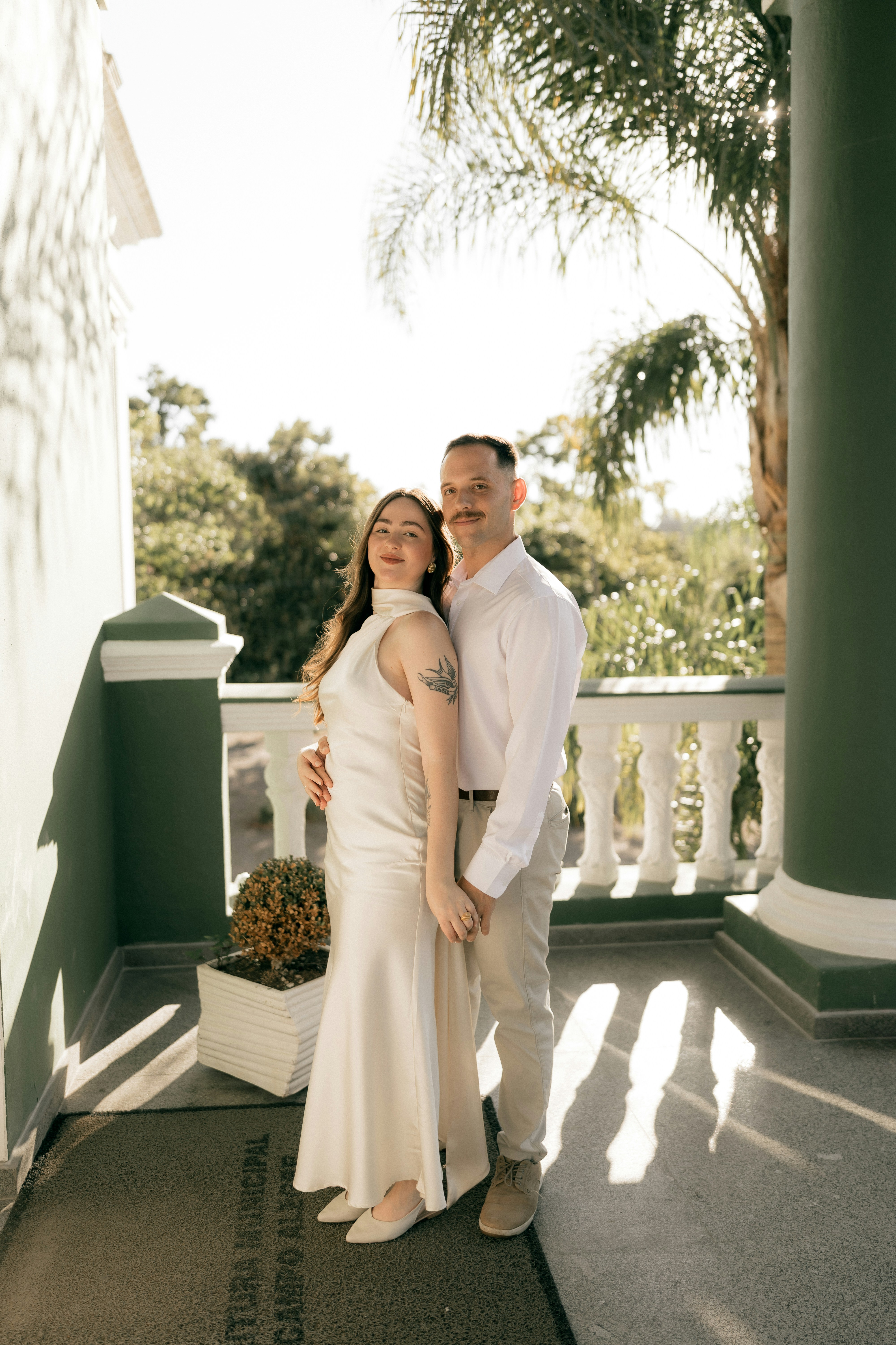 Sunlit Veil: Embrace on a Terrace