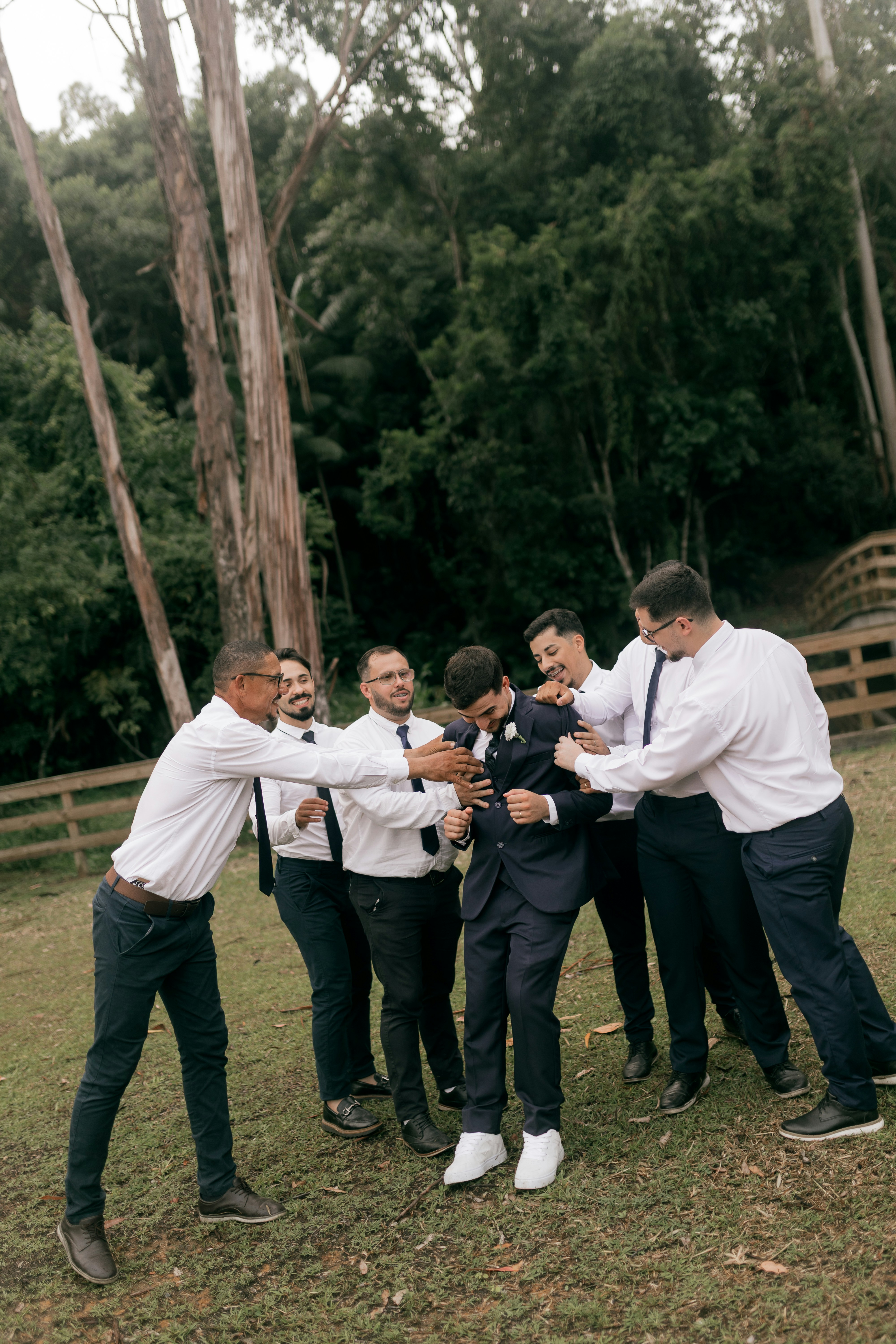 The Groom in the Center: A Chorus of Hands at the Edge of the Forest