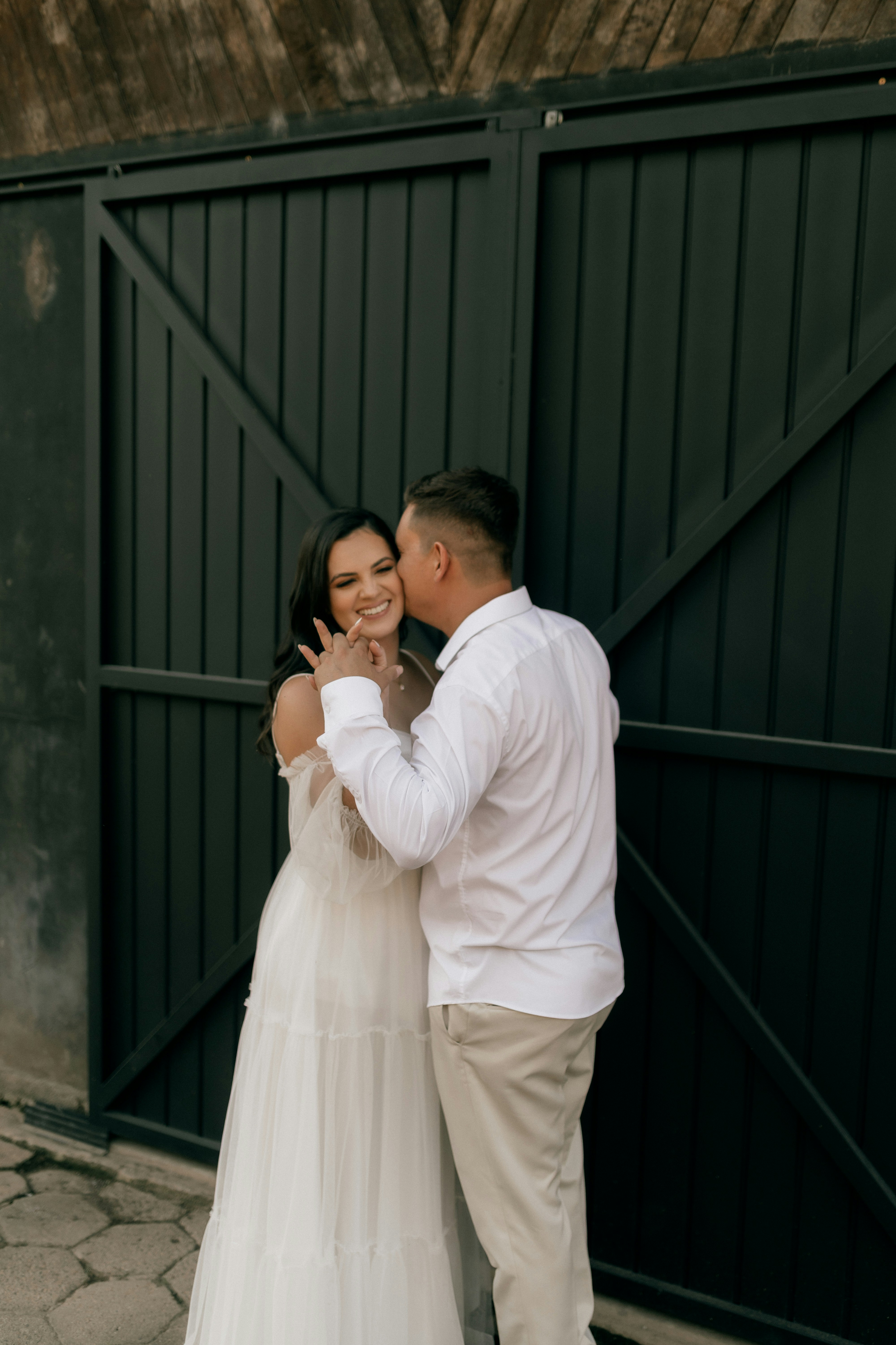 Whispered vows by the barn doors