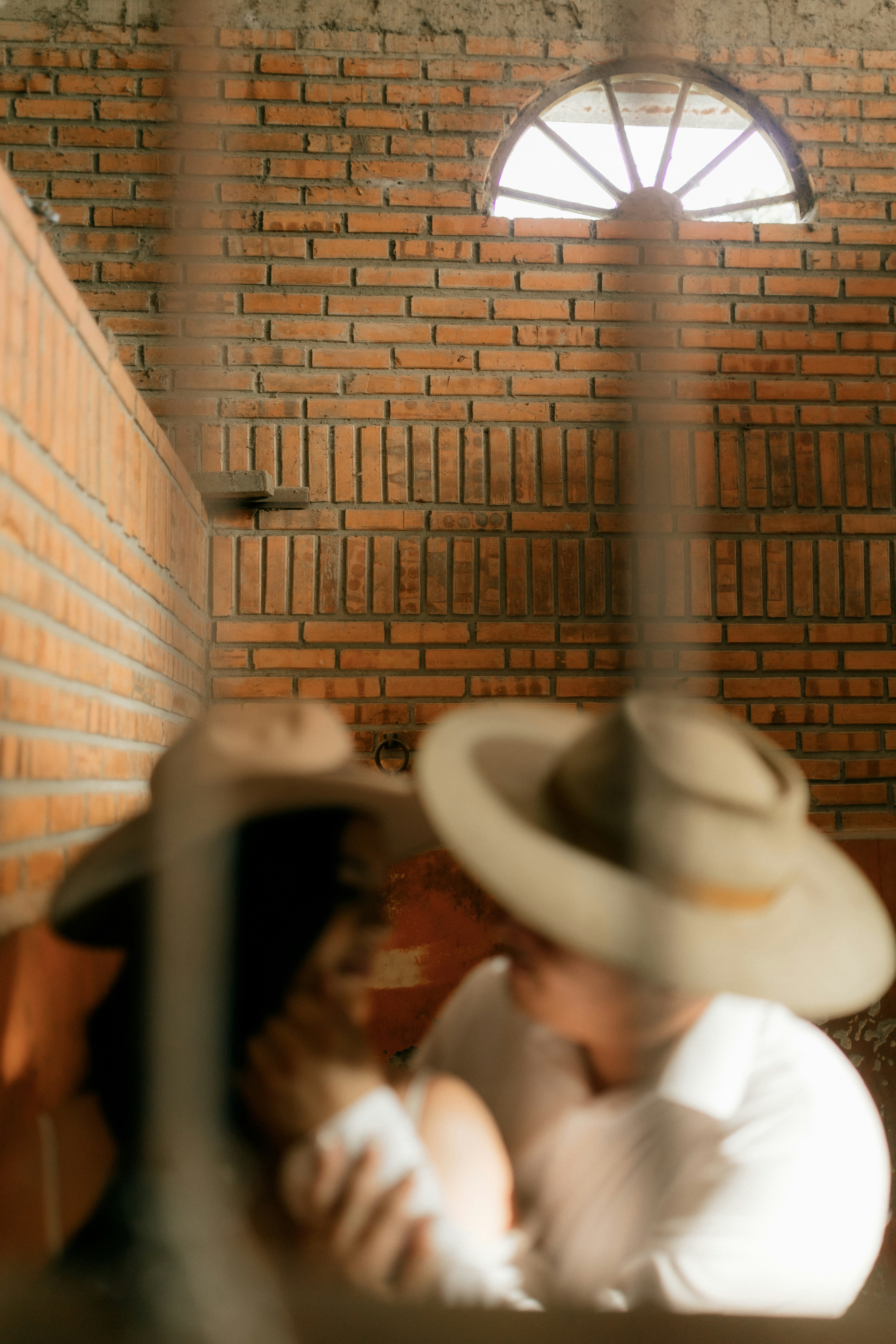 Whispered Moment Under Brick Arches