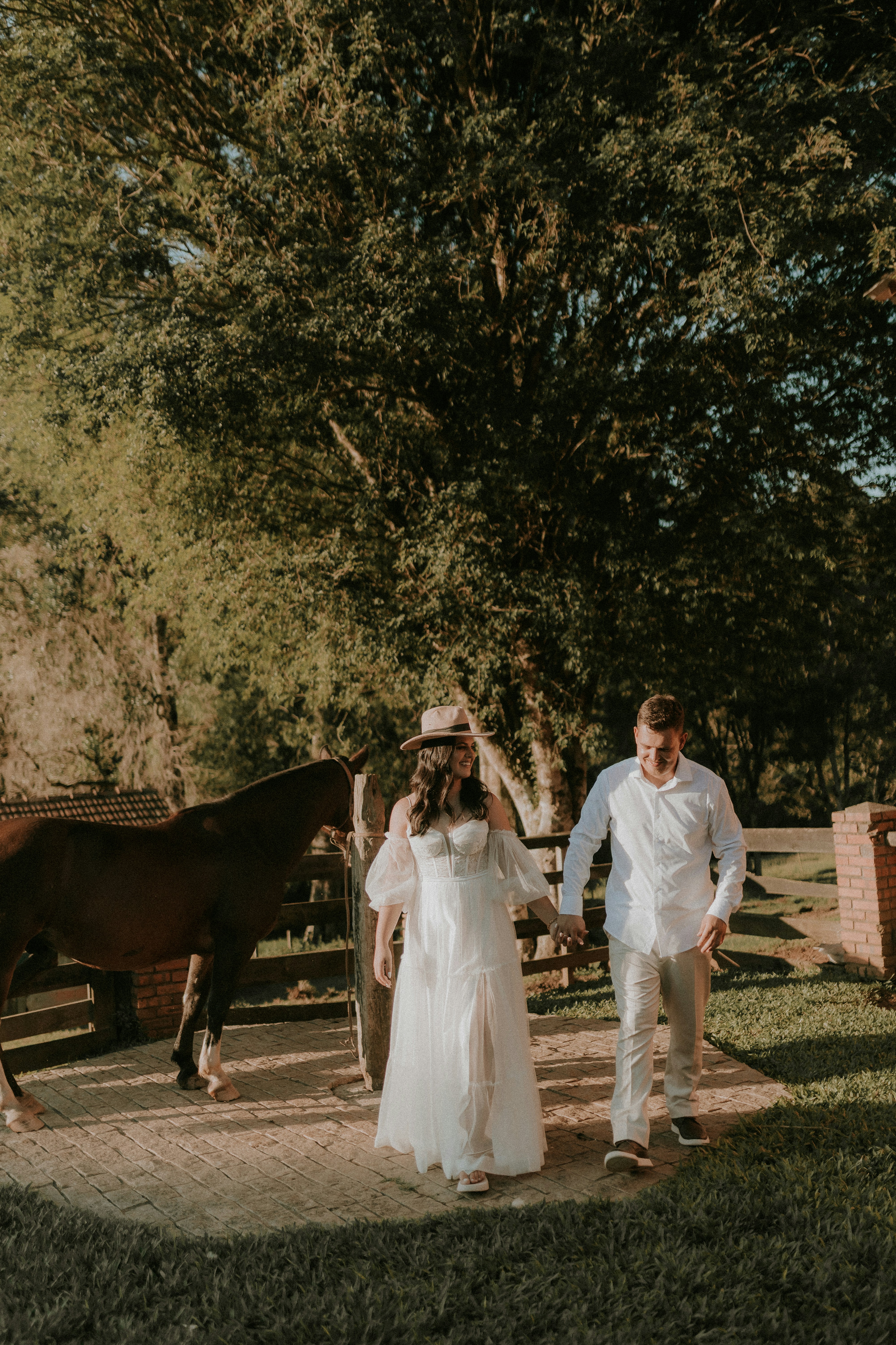 Holding Hands Under Dappled Light: A Quiet Moment Beyond the Stall