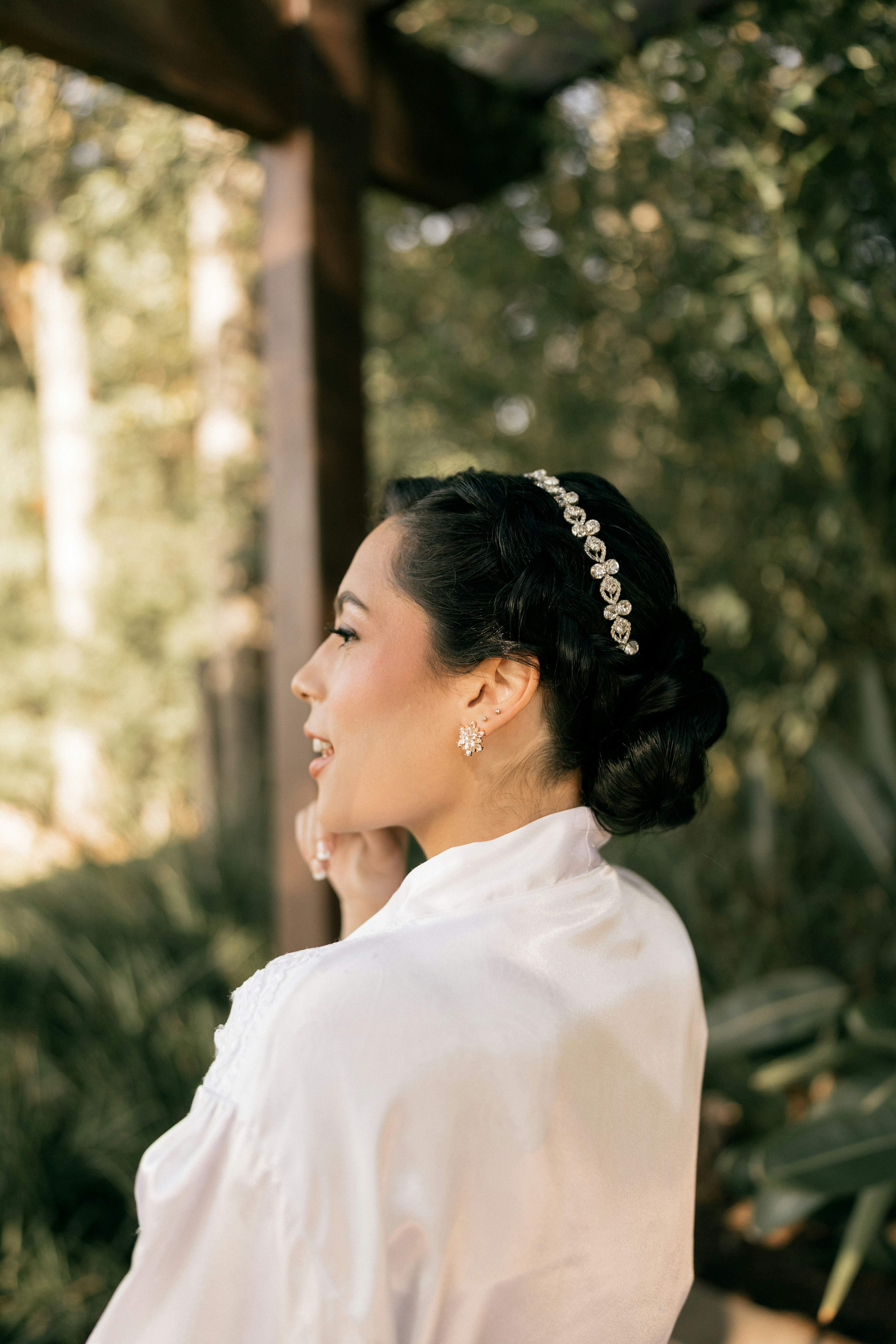 Graceful Bride in Soft Light Under a Garden Arbor