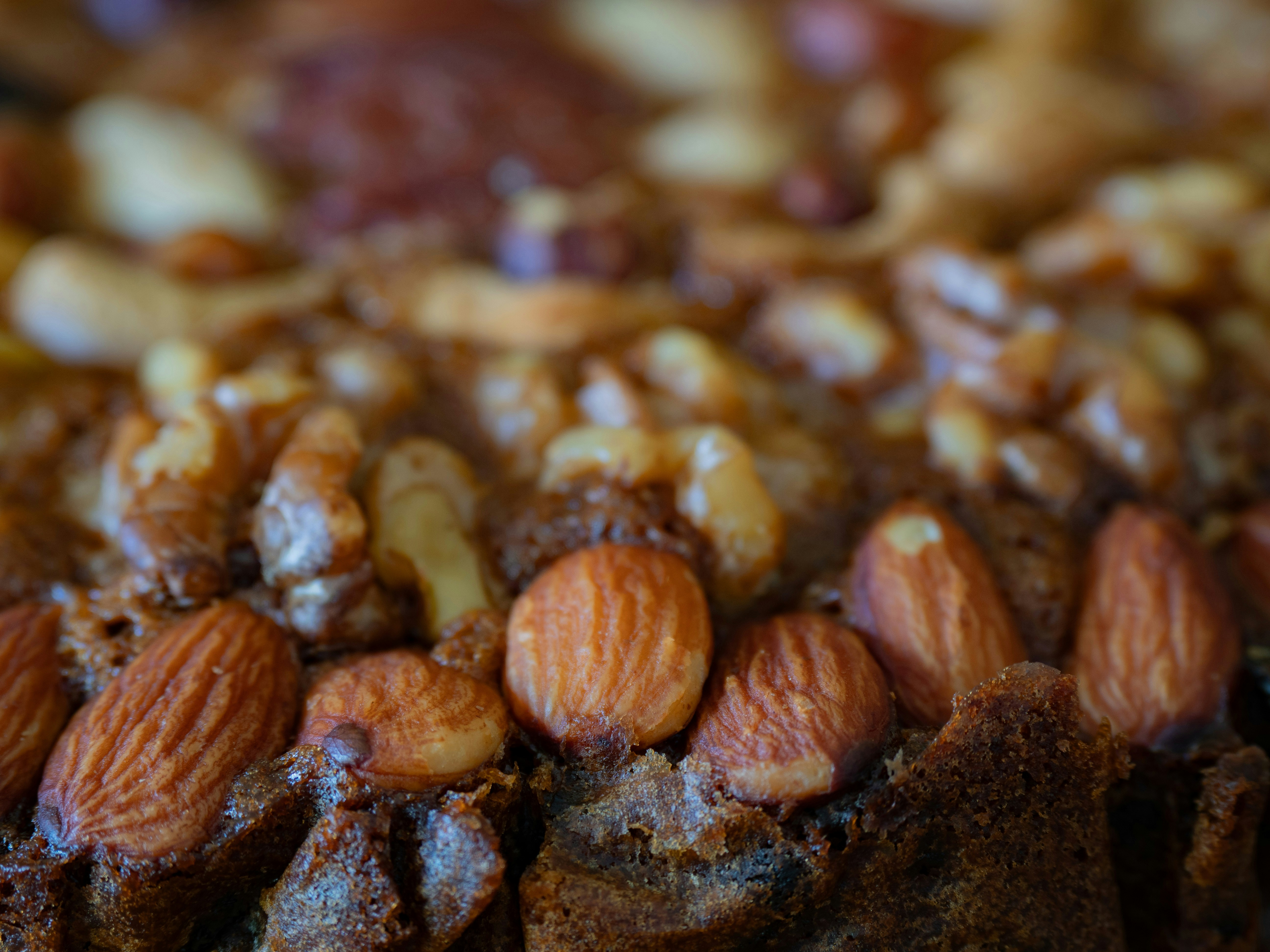 Crunchy Almonds Crowned with Caramelized Pecans on a Rustic Dessert Bake