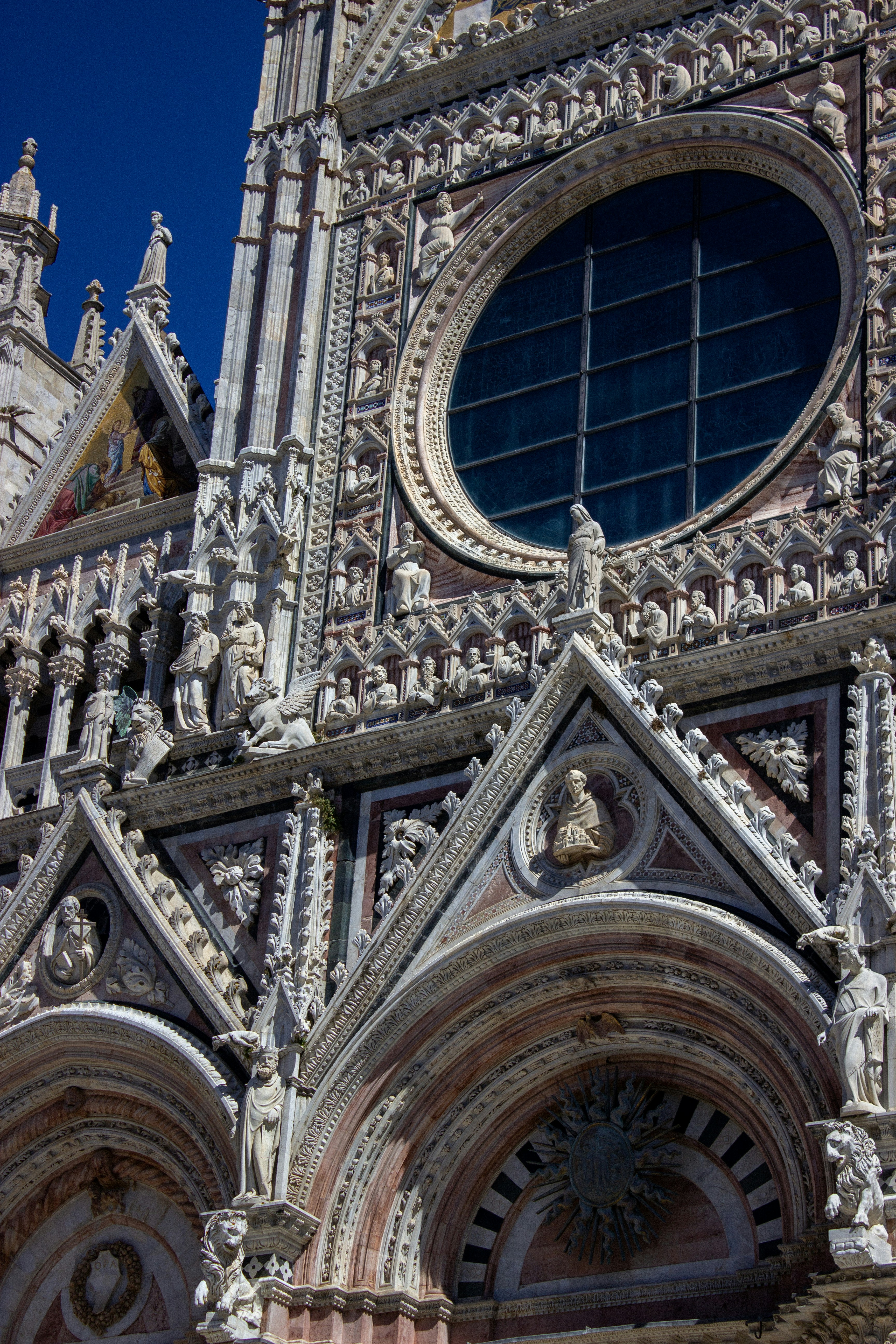Gothic Facade in Detail: Saints and Arches Framing a Grand Circular Window