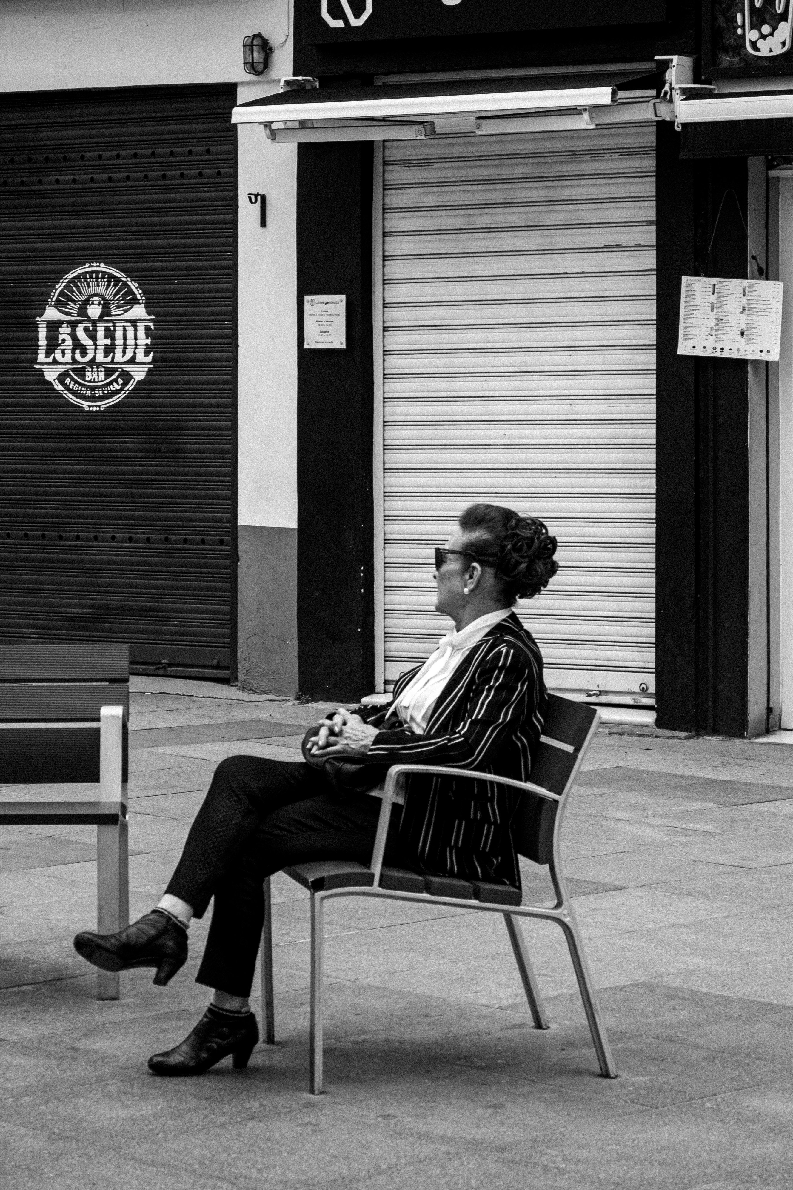 Silhouette in the Square: A Quiet Portrait on a Bench