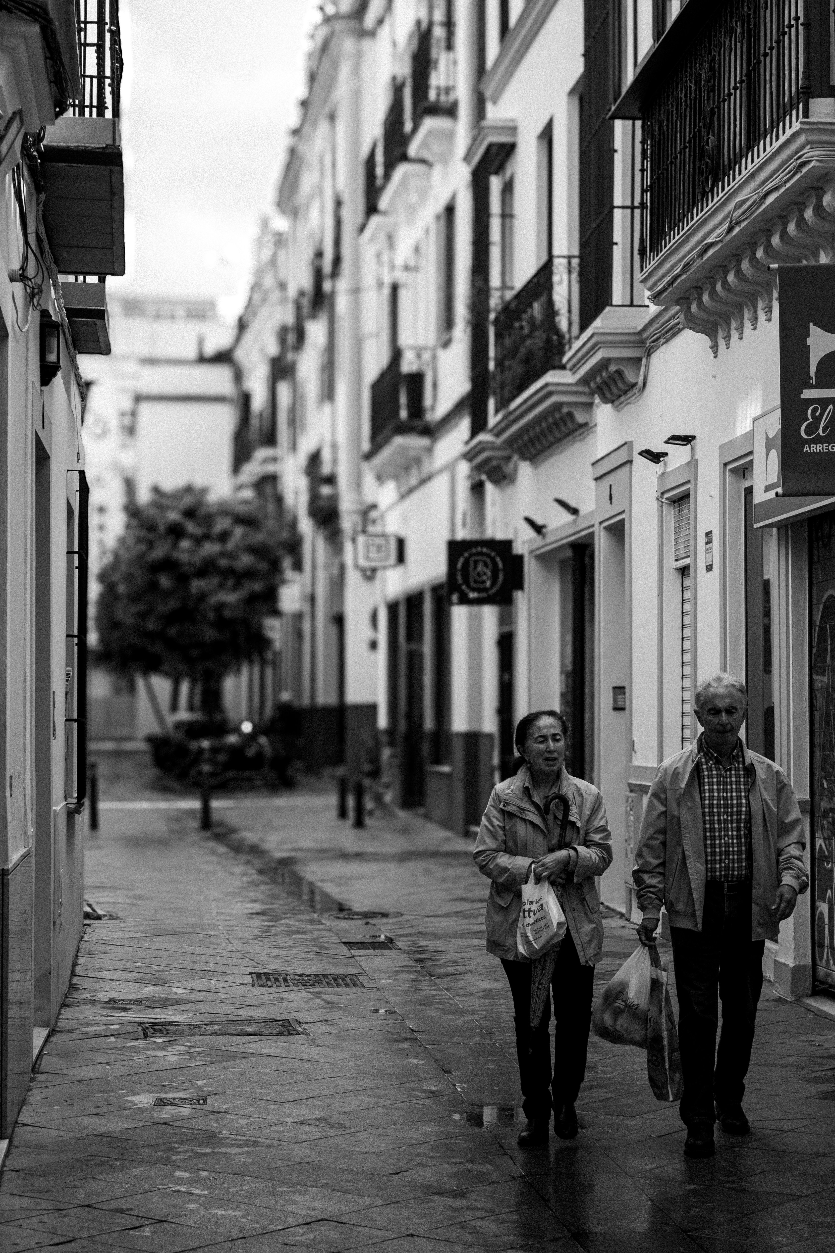 Street Walk: Quiet Conversation in a Monochrome Alley
