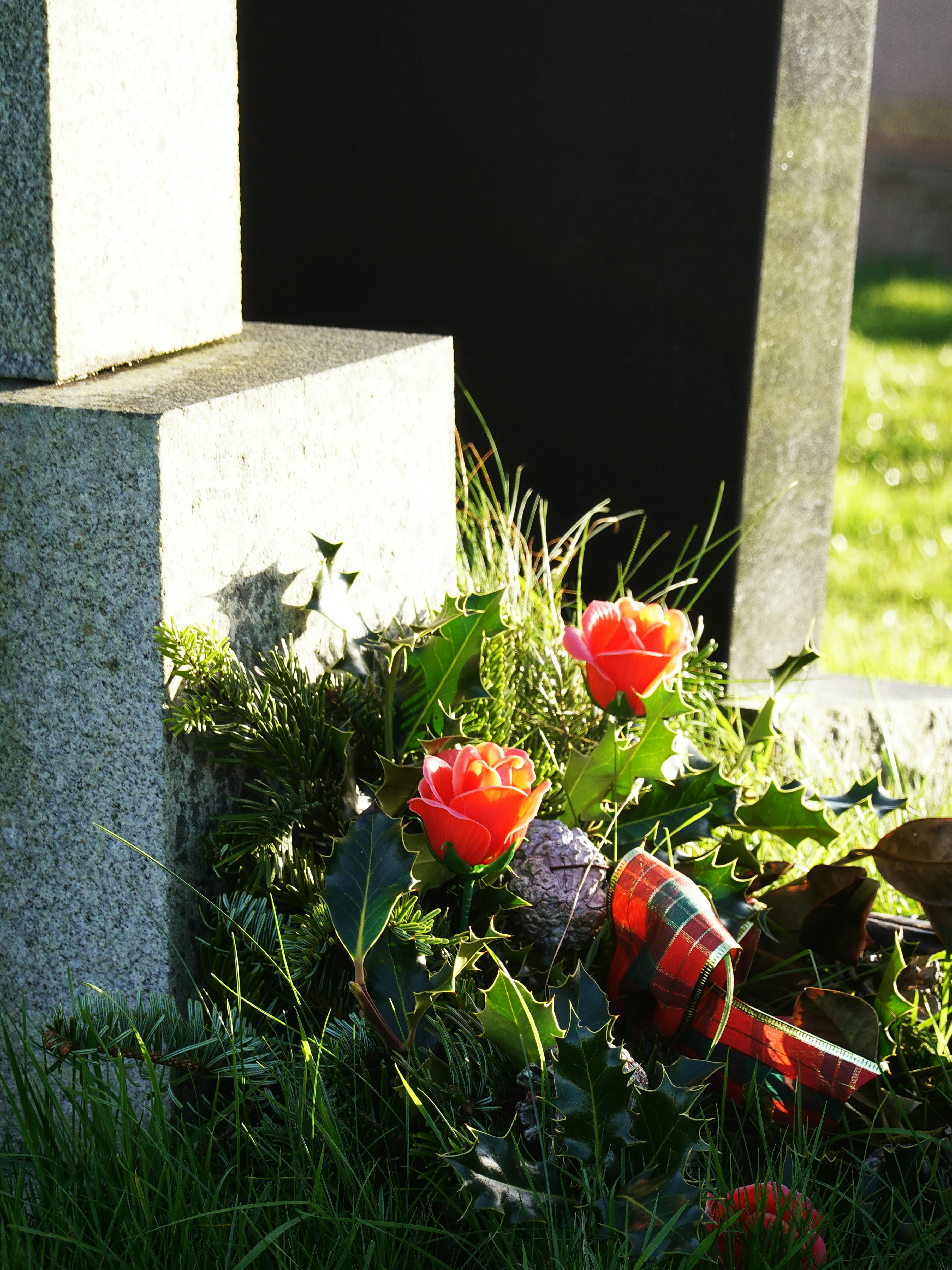 Floral Tribute at the Foot of a Monument