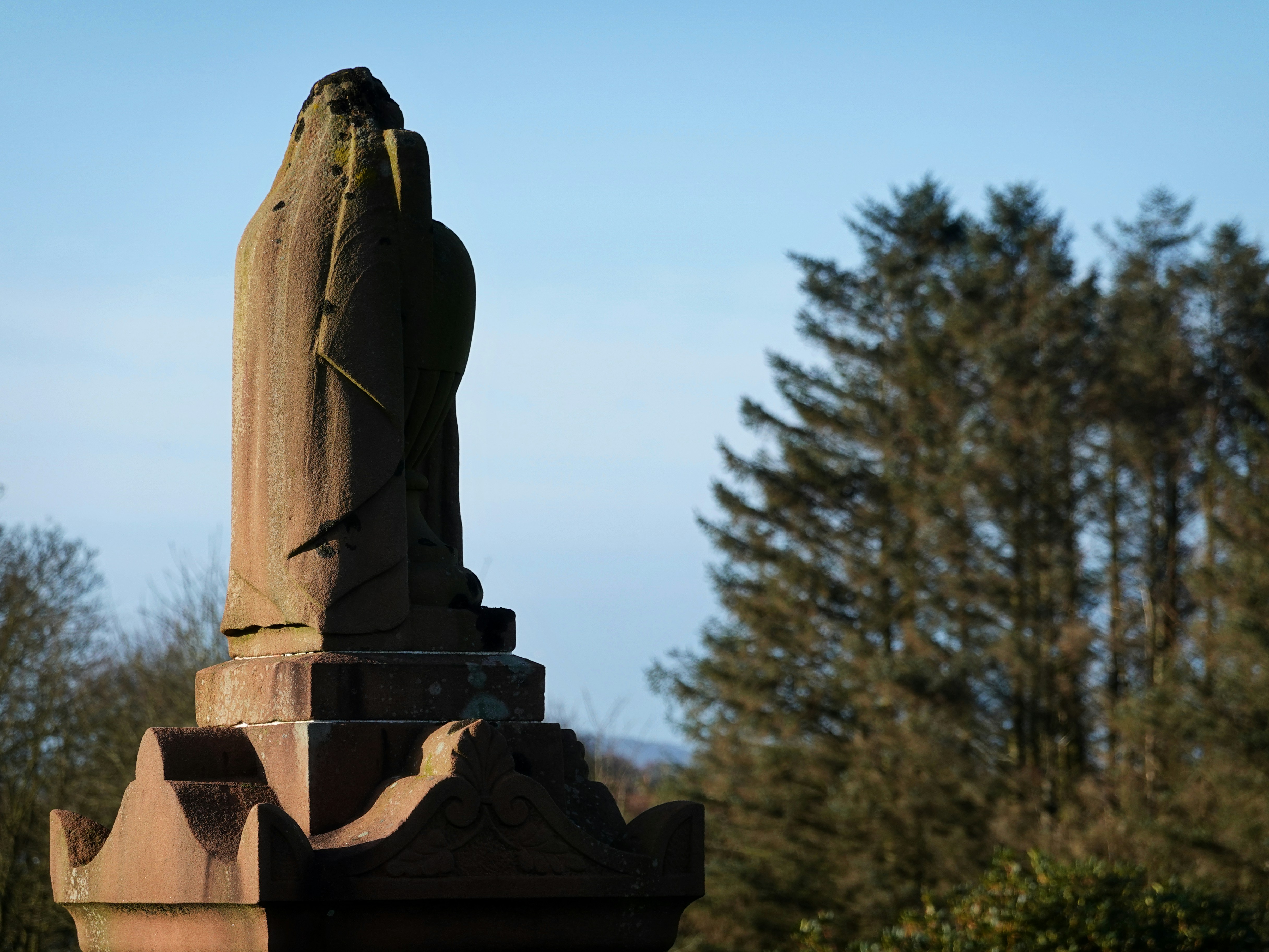 Stone Monument Overseen by Silent Pines