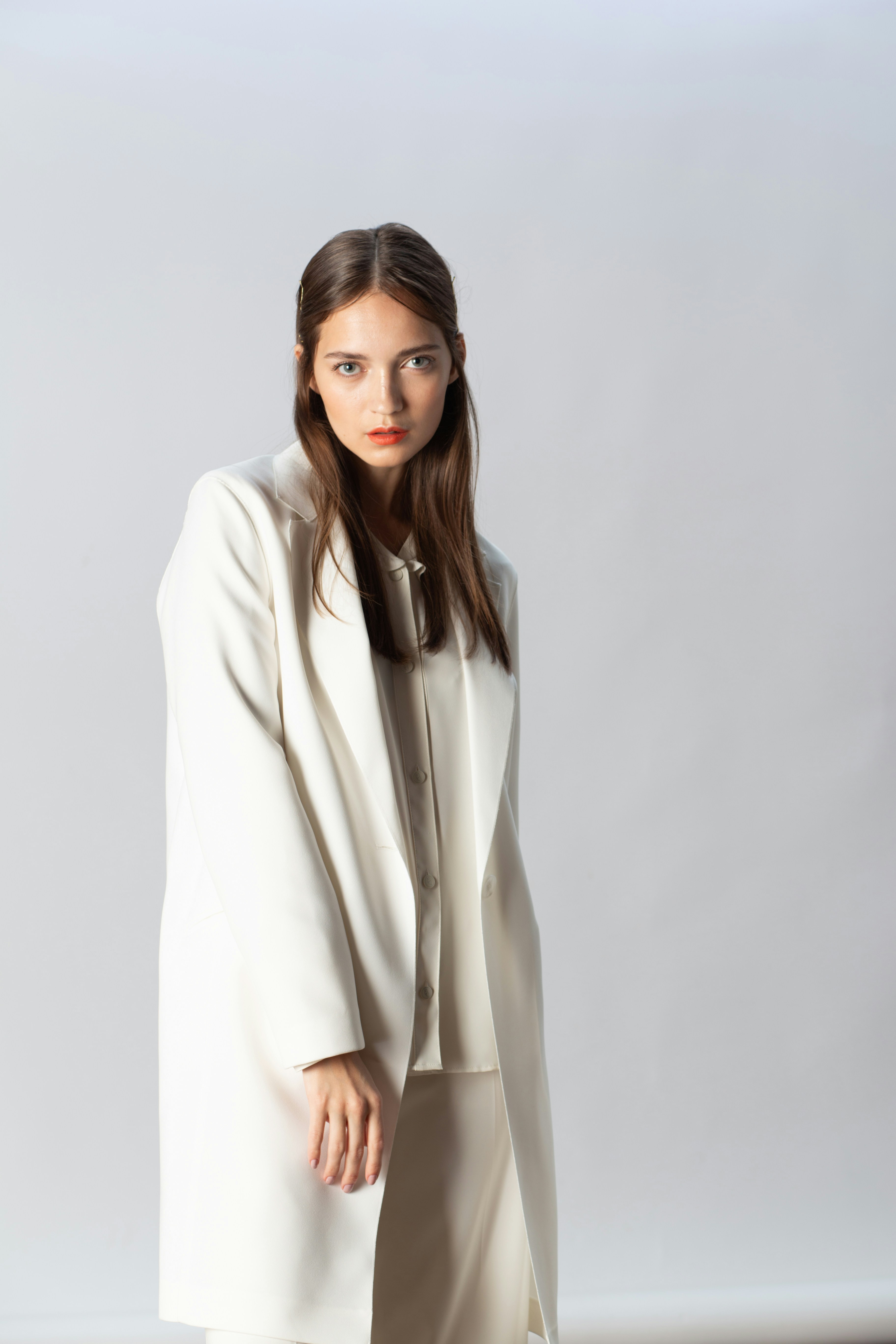 Minimalist Bold: A Modern White-suit Portrait