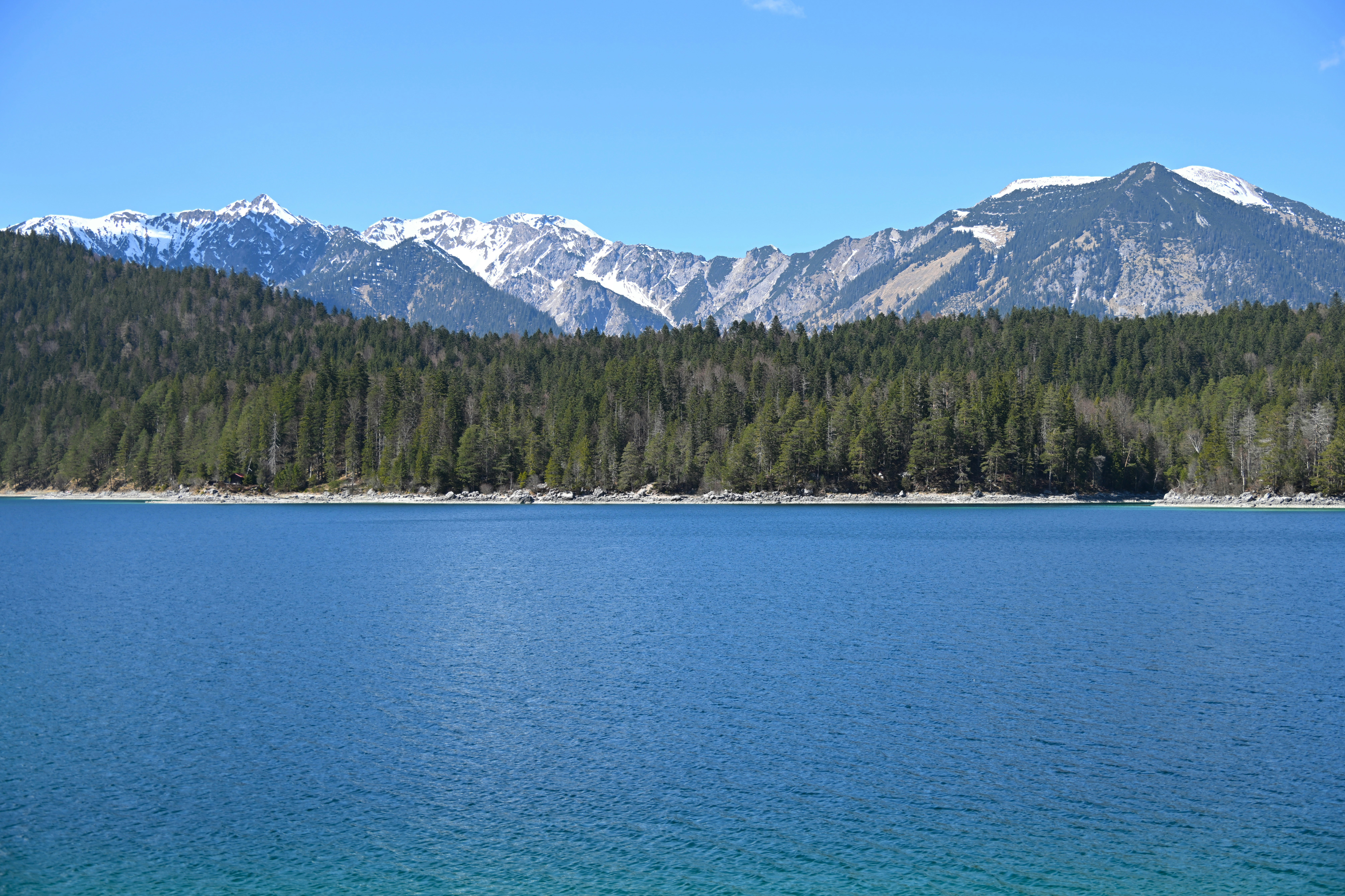 Azure Quiet: Snow-dusted Peaks over a Glassy Alpine Lake